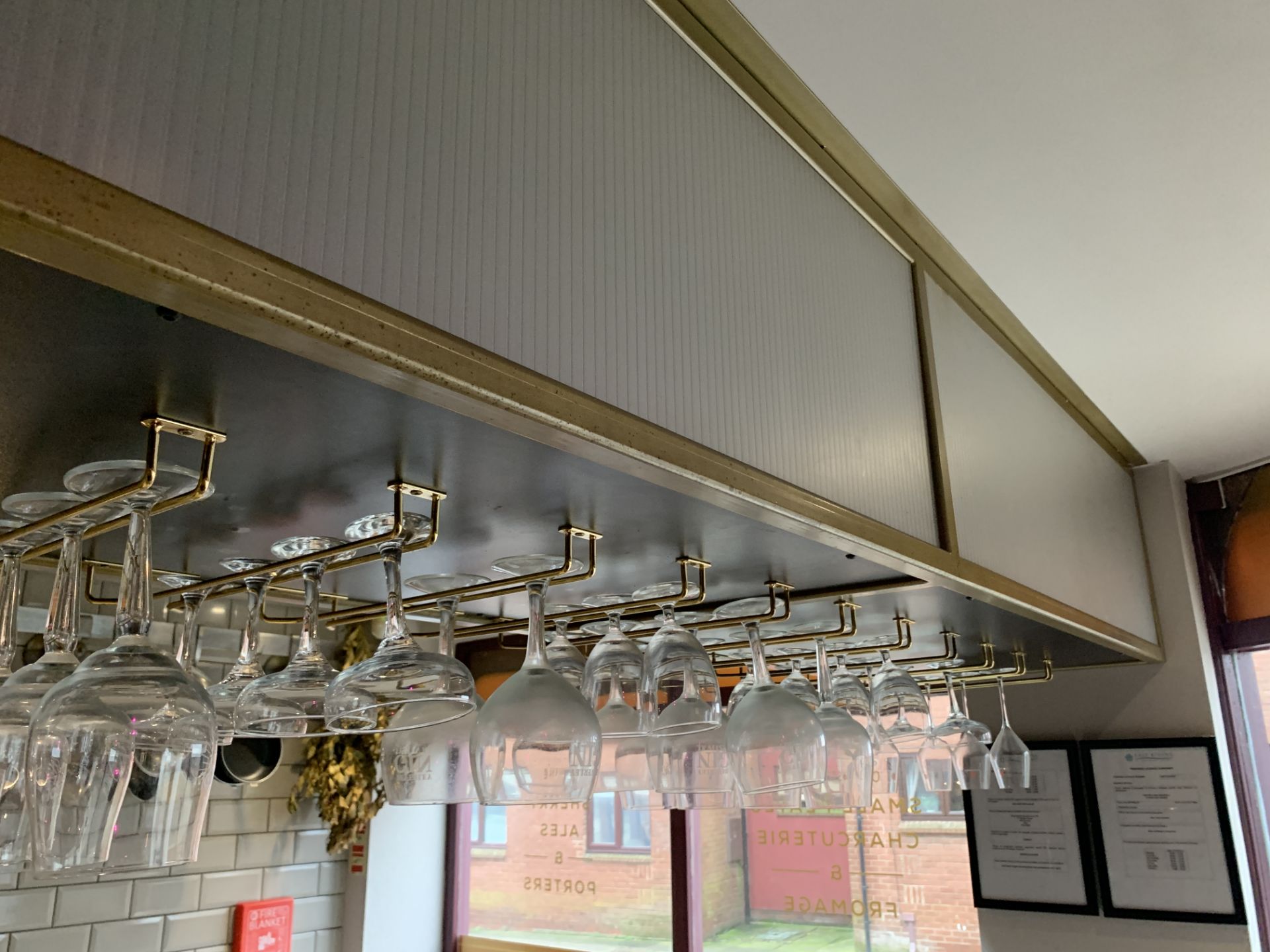 Assorted Drinking Glassware together with Suspended Overhead Cabinet ...