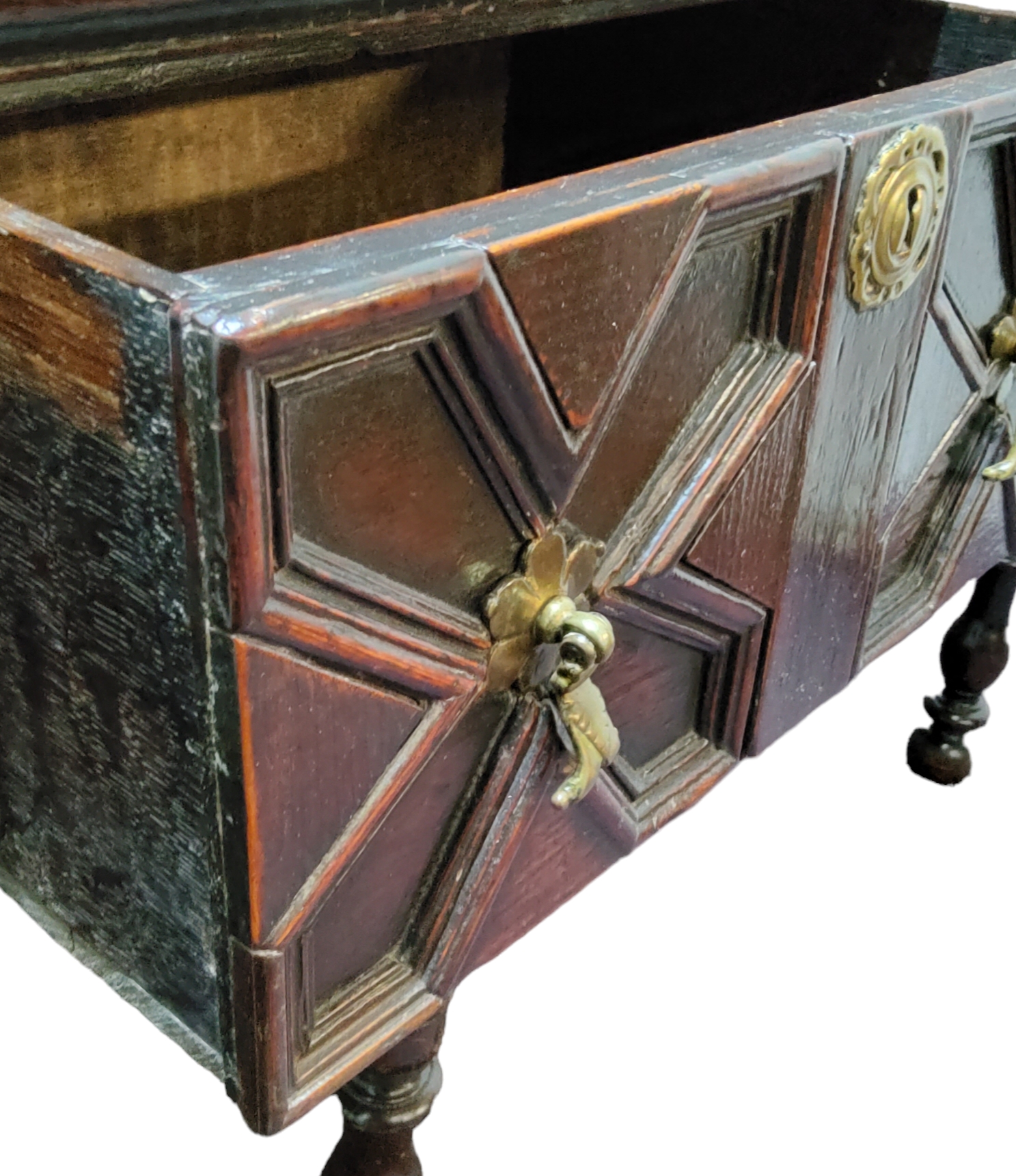 A Charles II oak low block front dresser, moulded oversailing top above ...
