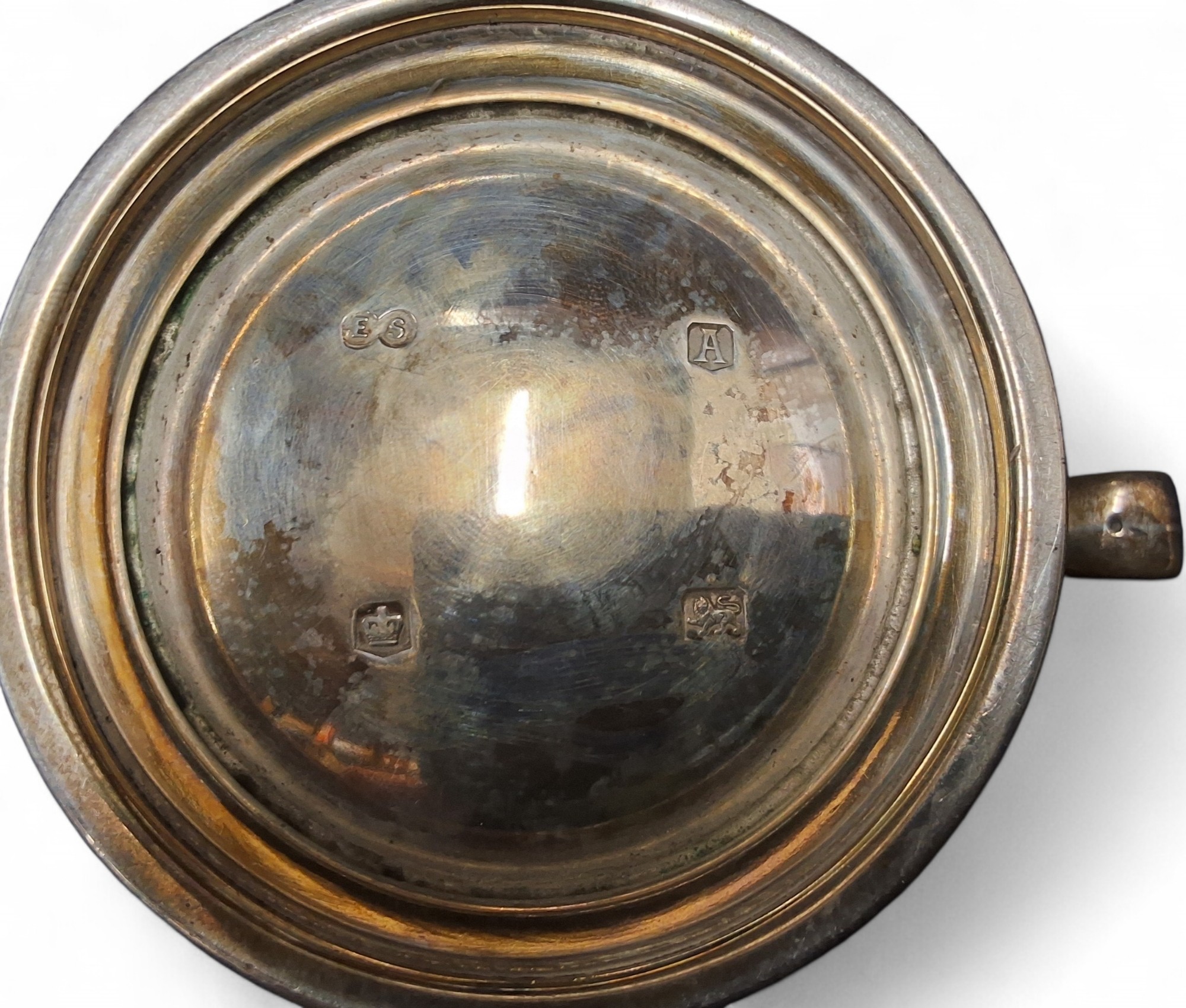A George VI silver baluster shaped mug, scroll handle monogrammed, E S ...