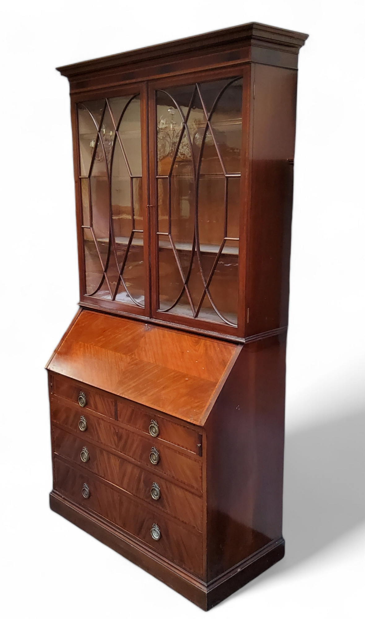 A Victorian mahogany and satinwood inlaid secretaire bookcase, the ...