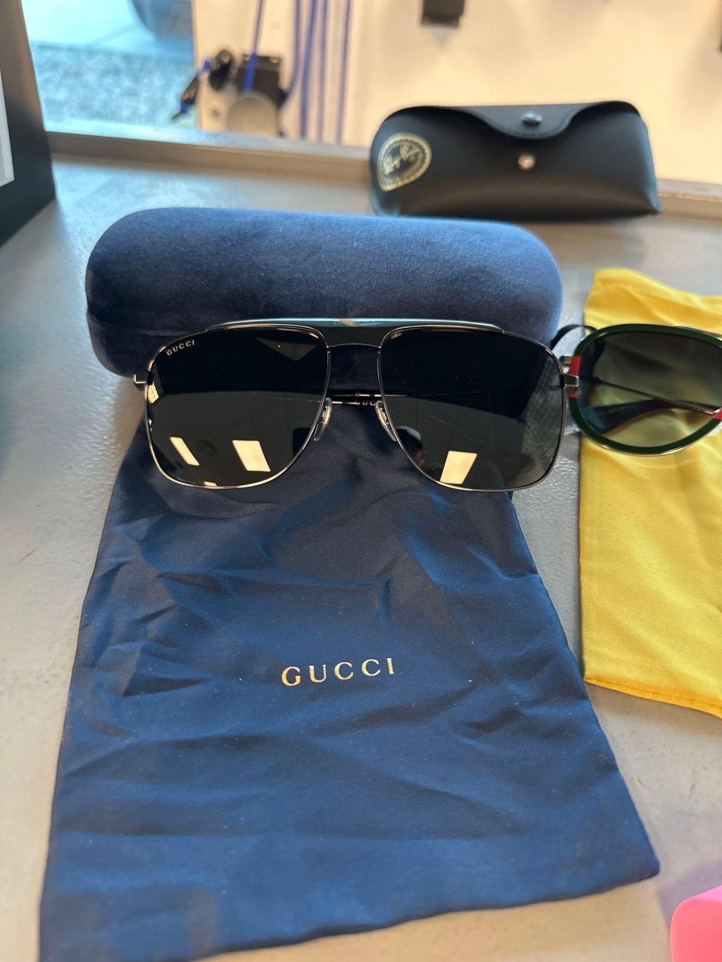 Two Gucci glasses. ( have not been authenticated)