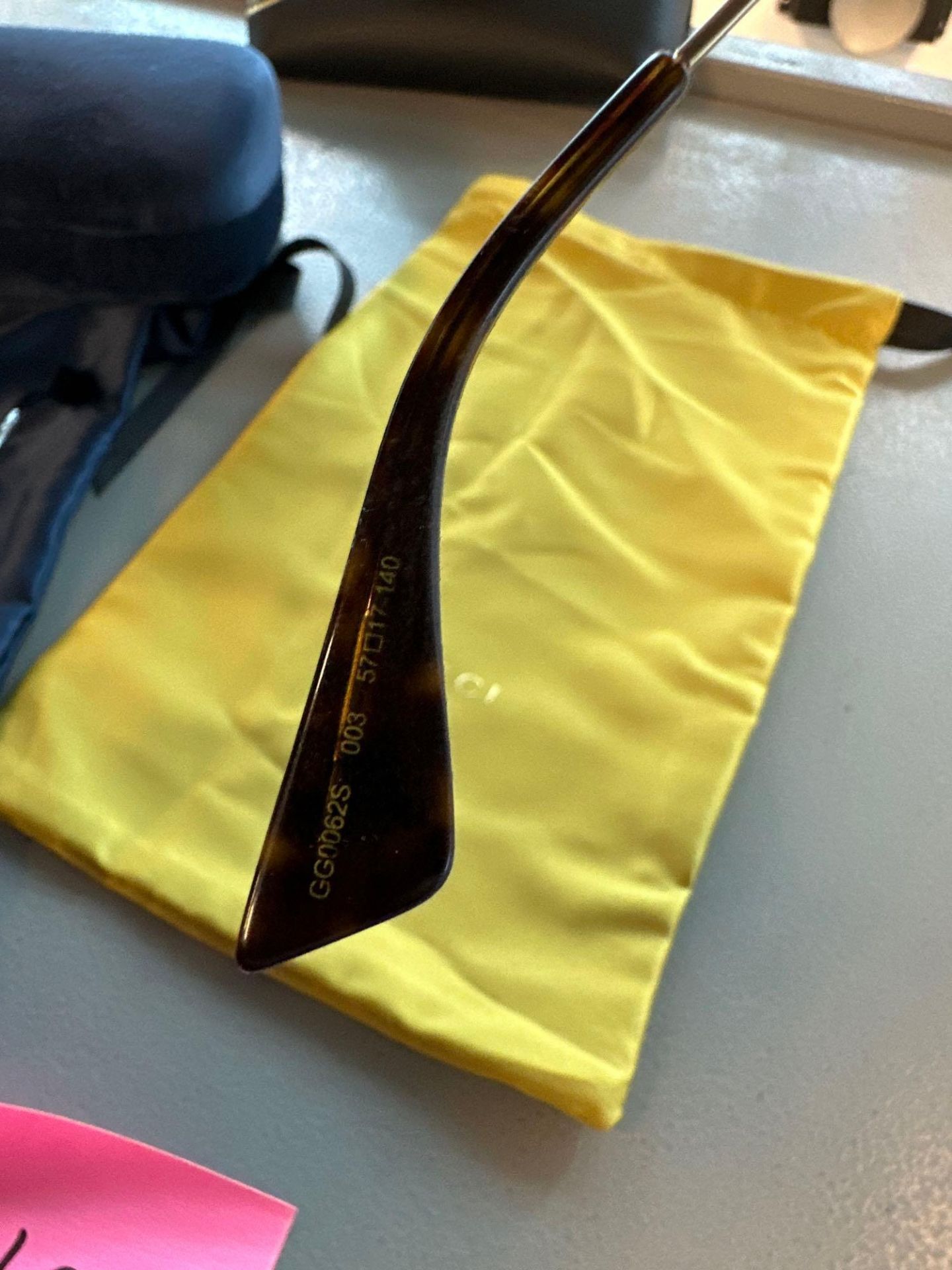 Two Gucci glasses. ( have not been authenticated)