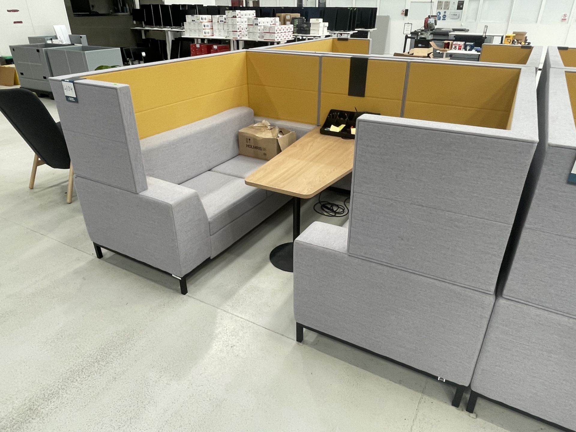 Sixteen3 Grey and yellow upholstered seating booth with wired table