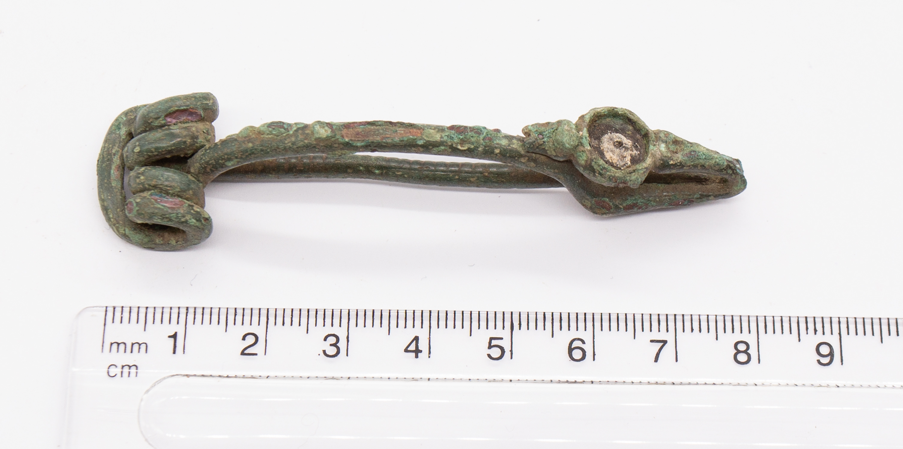 Iron age/Celtic La Tène fibula brooch made of a copper alloy. The ...