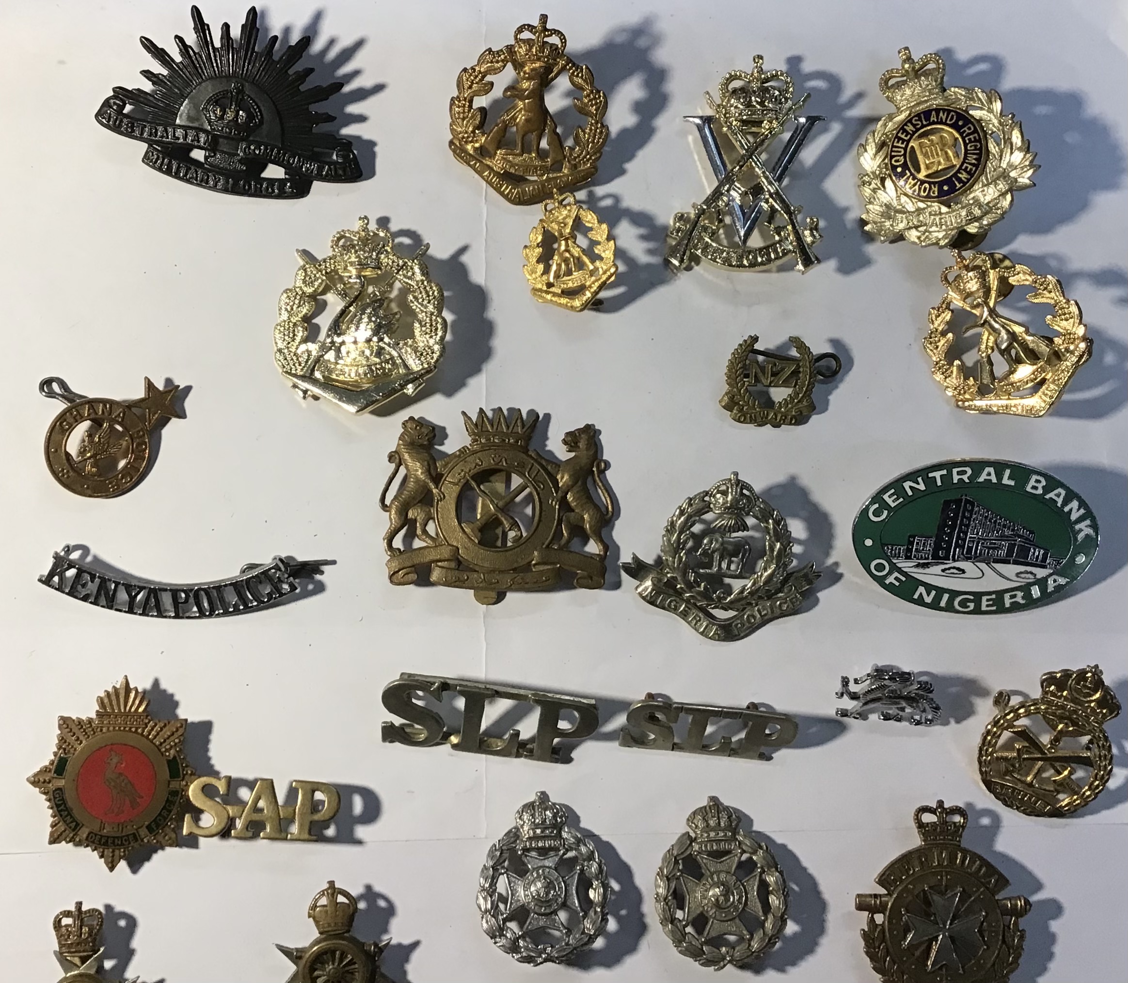 Collection of Commonwealth and Colonial Cap & Uniform badges.
