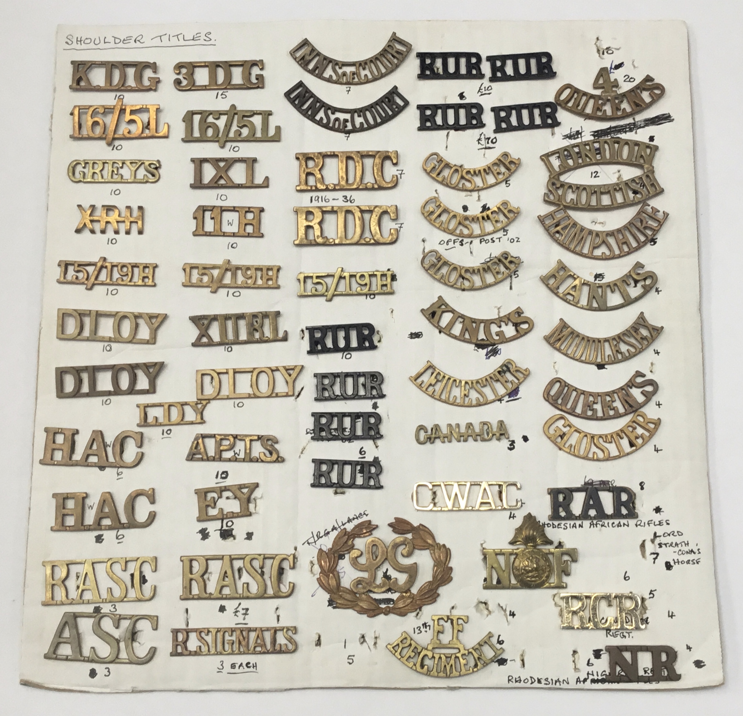 A selection of WW1 and later brass shoulder titles, with many cavalry ...