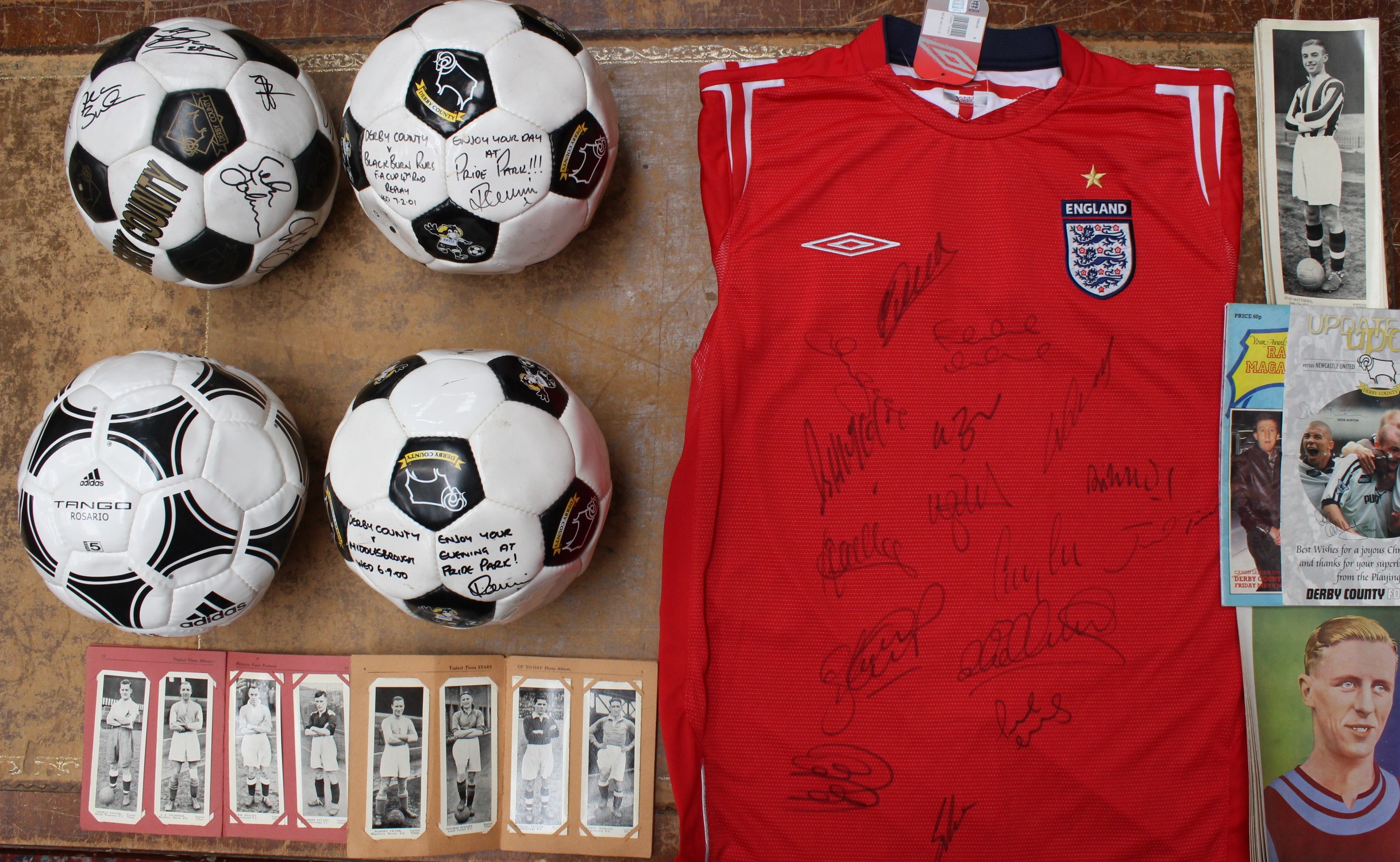 Football: A collection of four footballs, one signed by various Derby ...