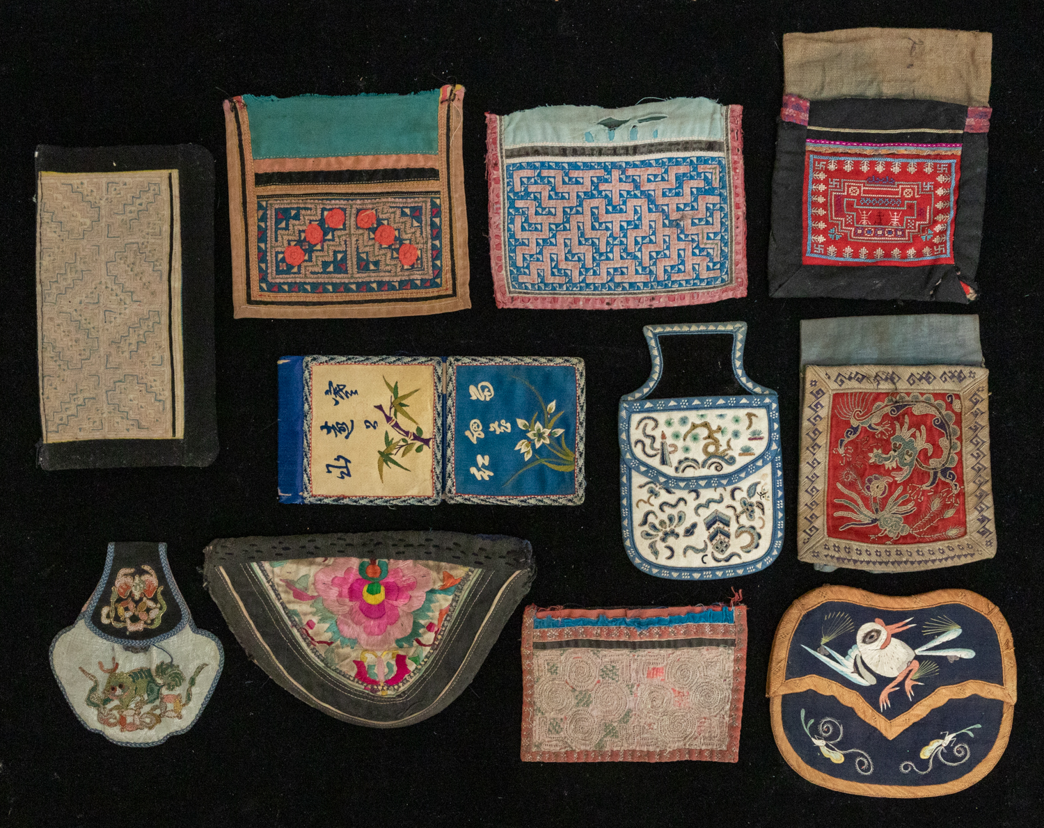 A collection of ten Chinese silk and cotton embroidered purses and ...