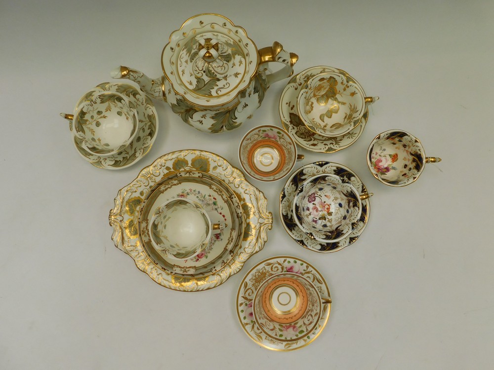A small collection of Rockingham porcelain to include three trios ...