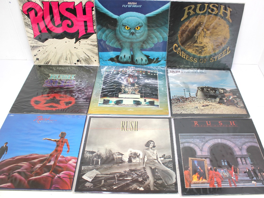 Collection of Rush vinyl lps housed in a vintage lp case. Including ...
