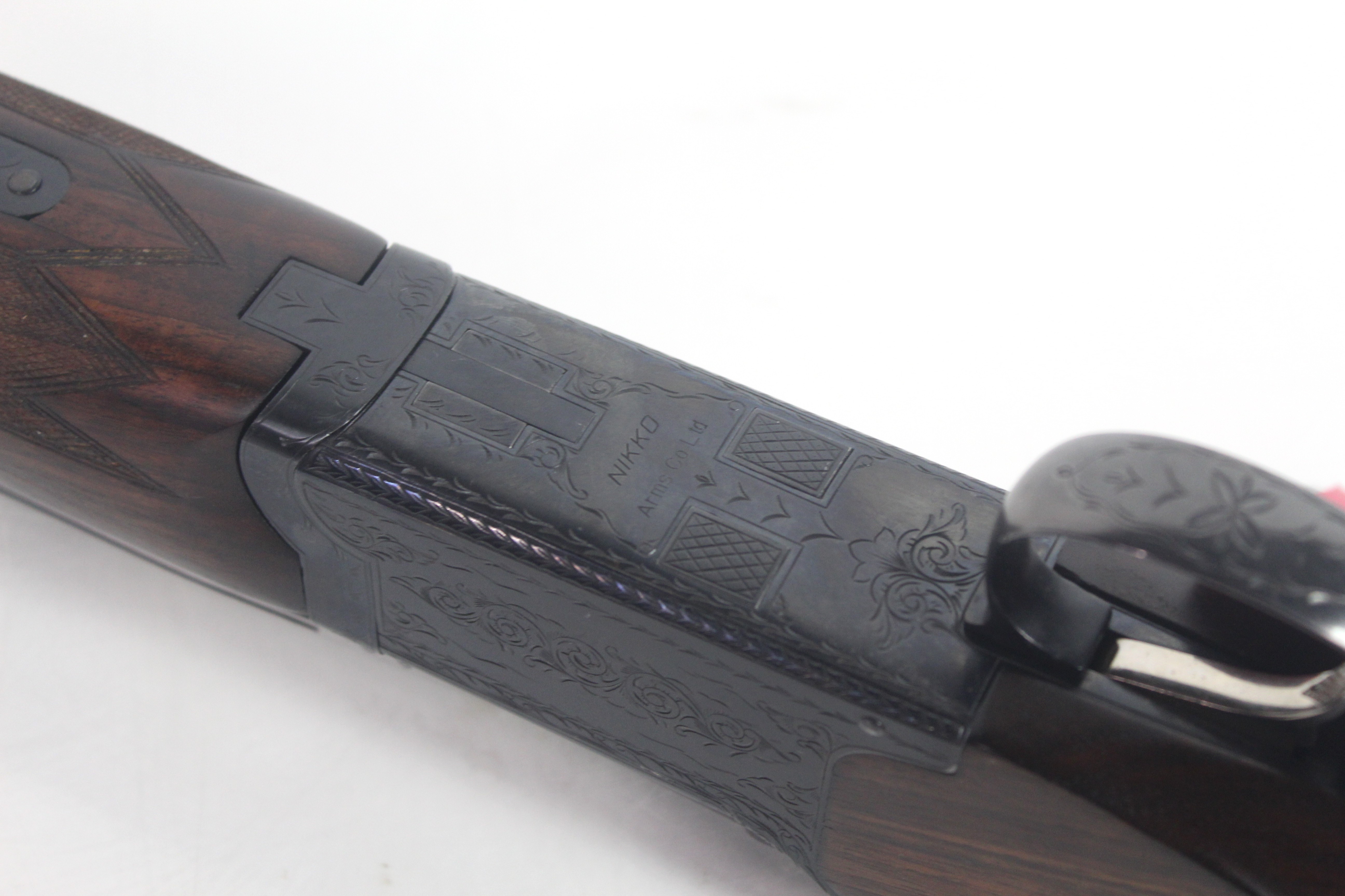 A Nikko over and under 12 bore shotgun with 27½" barrels having ...