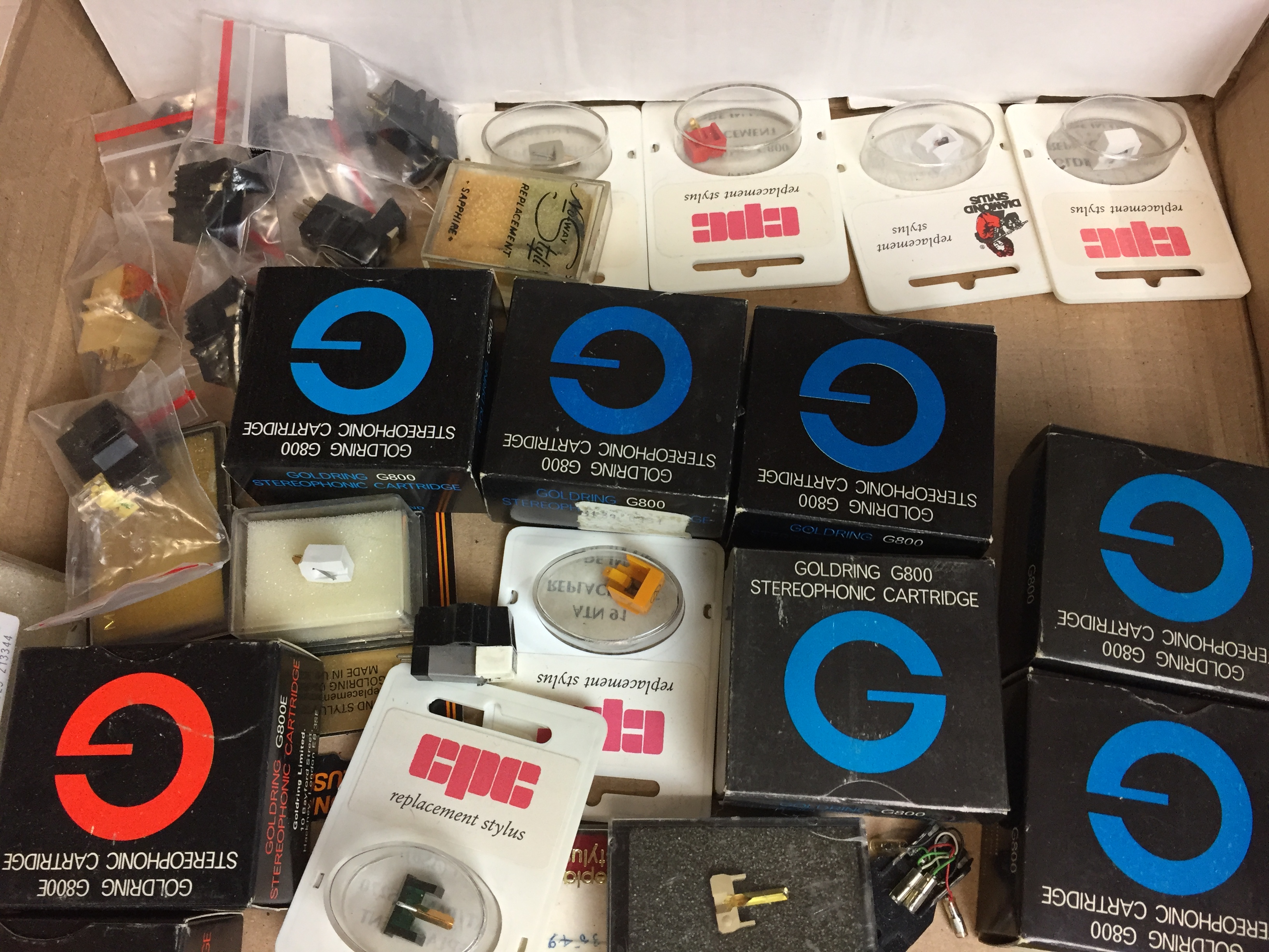 Grey plastic box containing record player cartridges, styluses, other ...