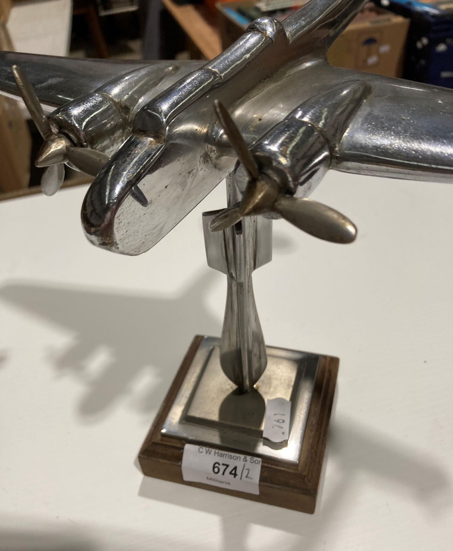 A chrome World War Two model aircraft, 25cm long, mounted on a chrome ...