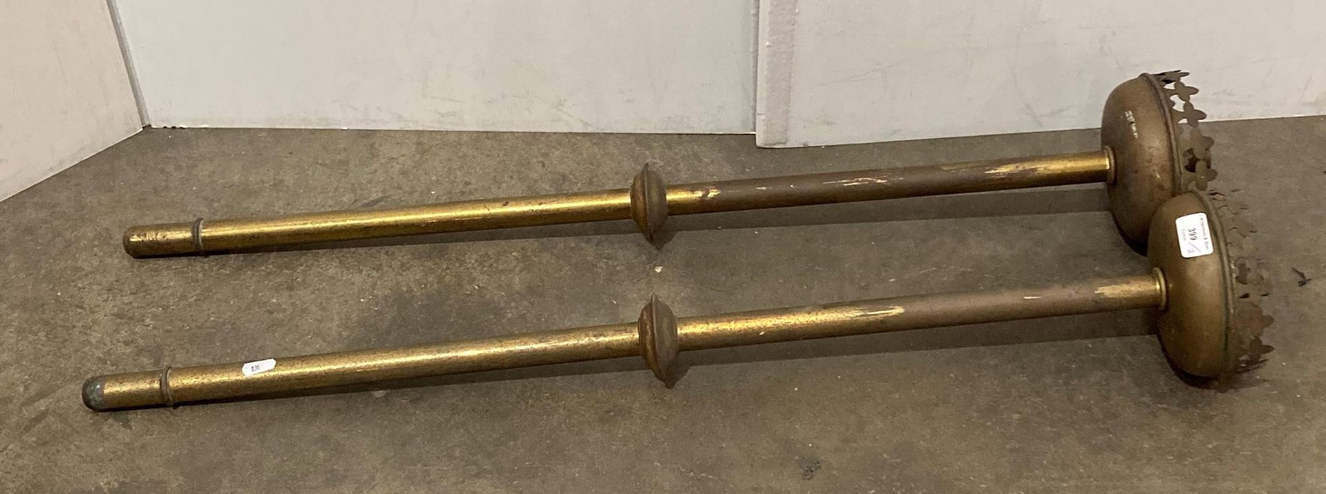 A pair of brass Medieval style wall hung torches/candle holders, each ...