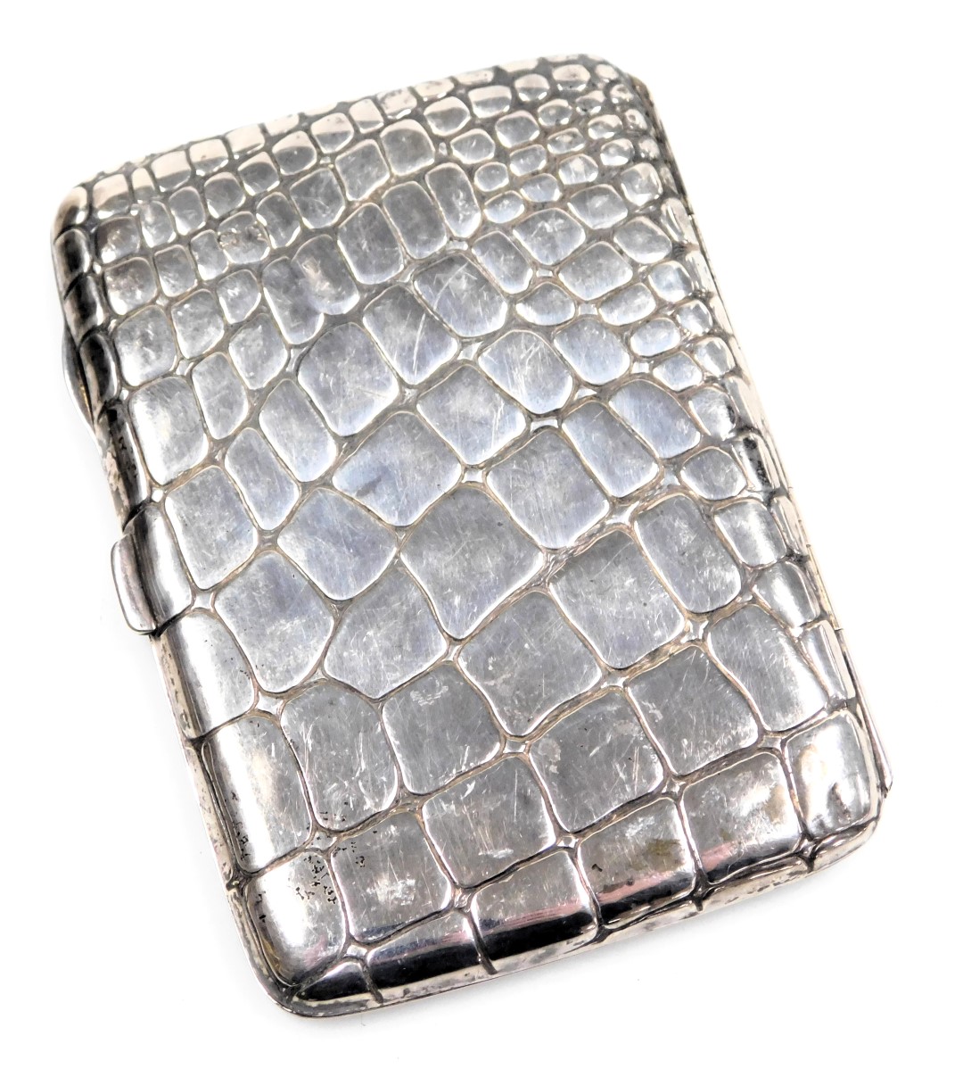 An early 20thC silver cigarette case, of simulated crocodile skin form ...