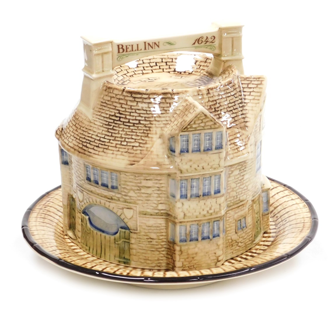 A London pottery cheese dish and cover, modelled as the Bell Inn ...