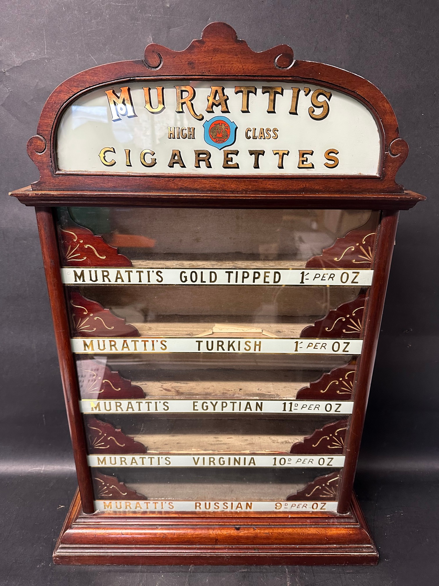 A Muratti's High Class Cigarettes shop counter, glass fronted ...
