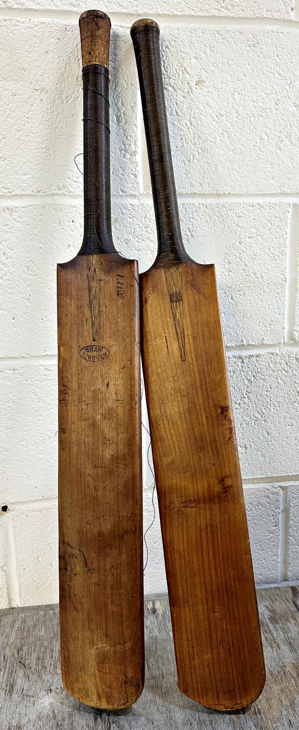 Two 19th century willow cricket bats, one by Shaw of Lincoln inscribed ...