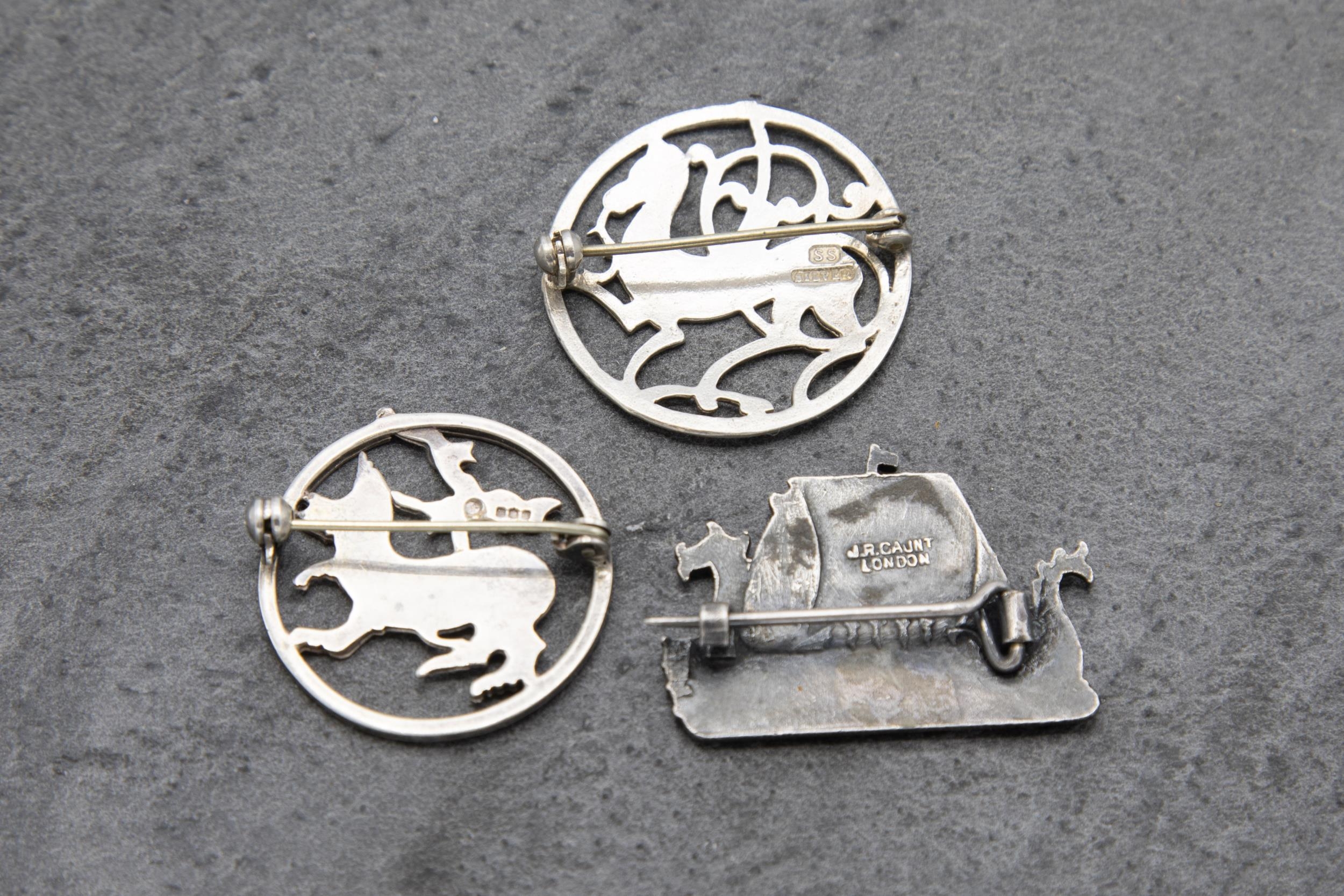 Two Scottish Ortak Maeshowe Dragon silver brooches, with a further ...