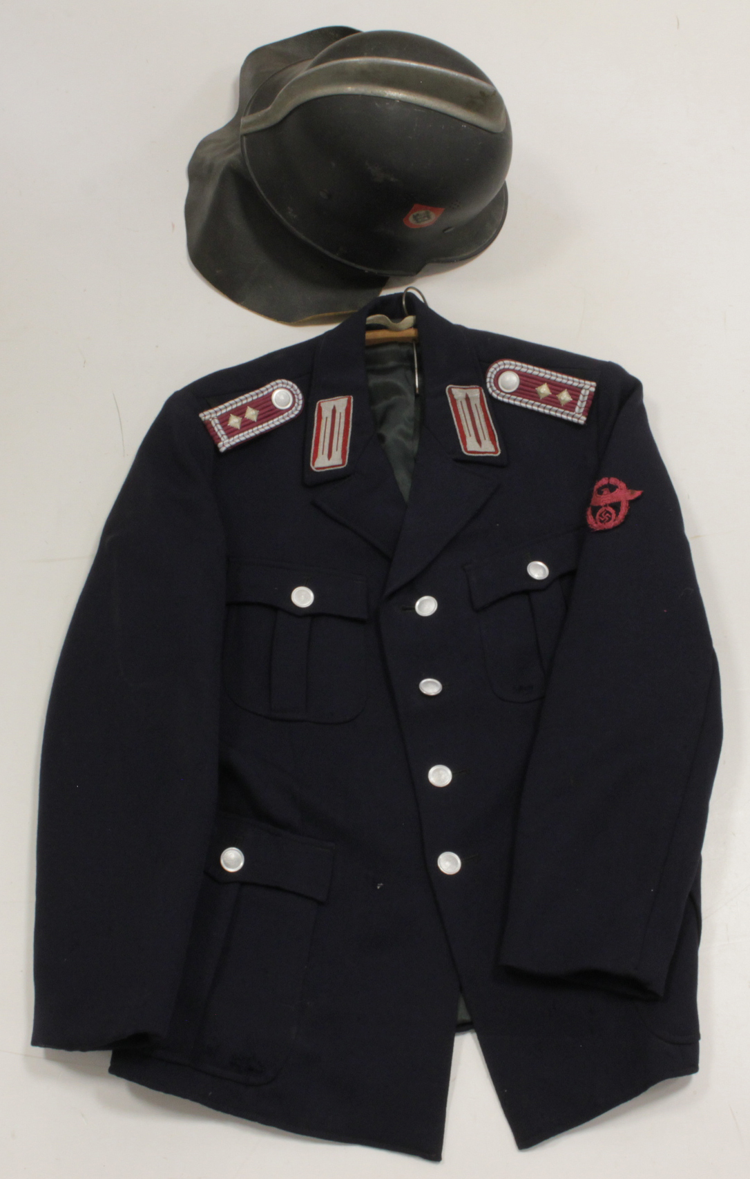 German WW2 fireman’s helmet with service jacket dress dagger in scabbard.