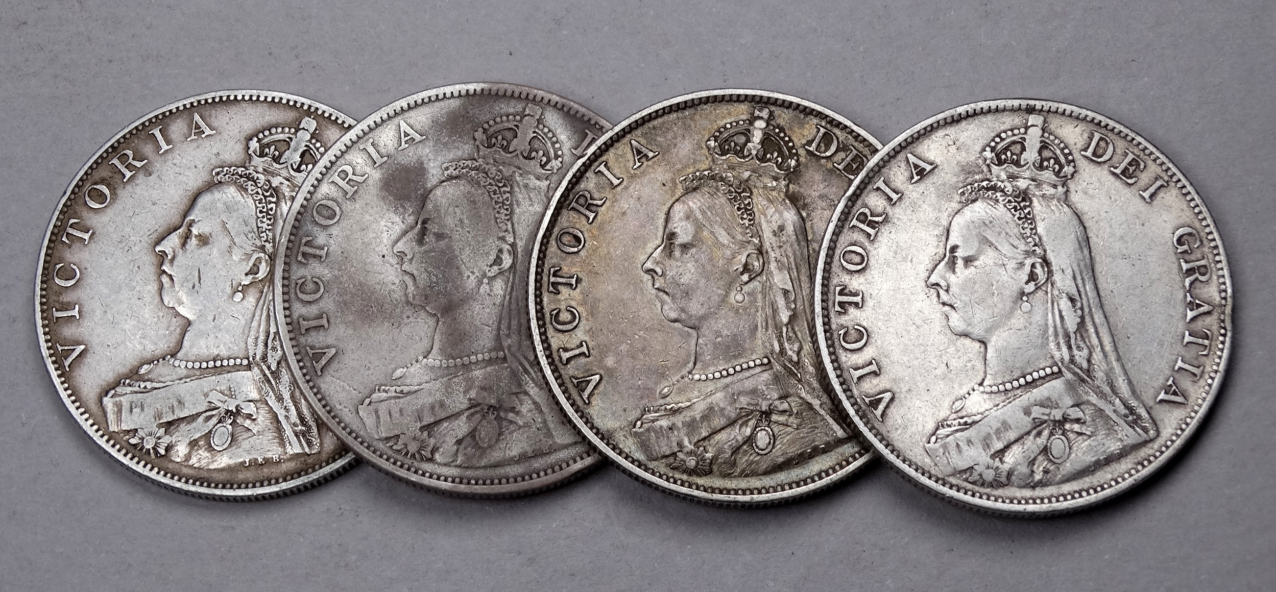 Four Victorian double florins - dated 1887,1888, 1889 and 1890.