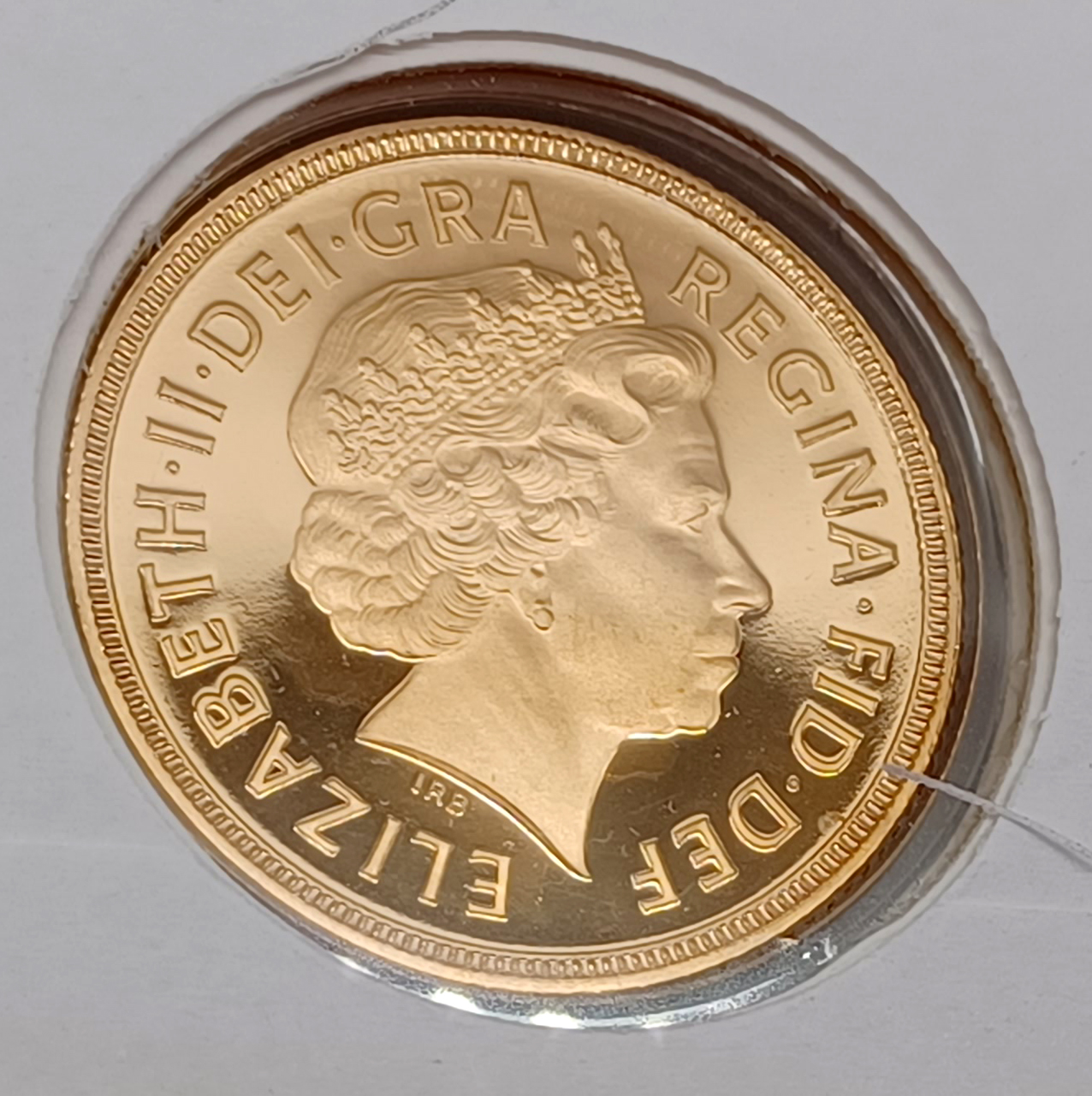 A Queen Elizabeth II Royal Mint 1999 Gold Sovereign on large ...