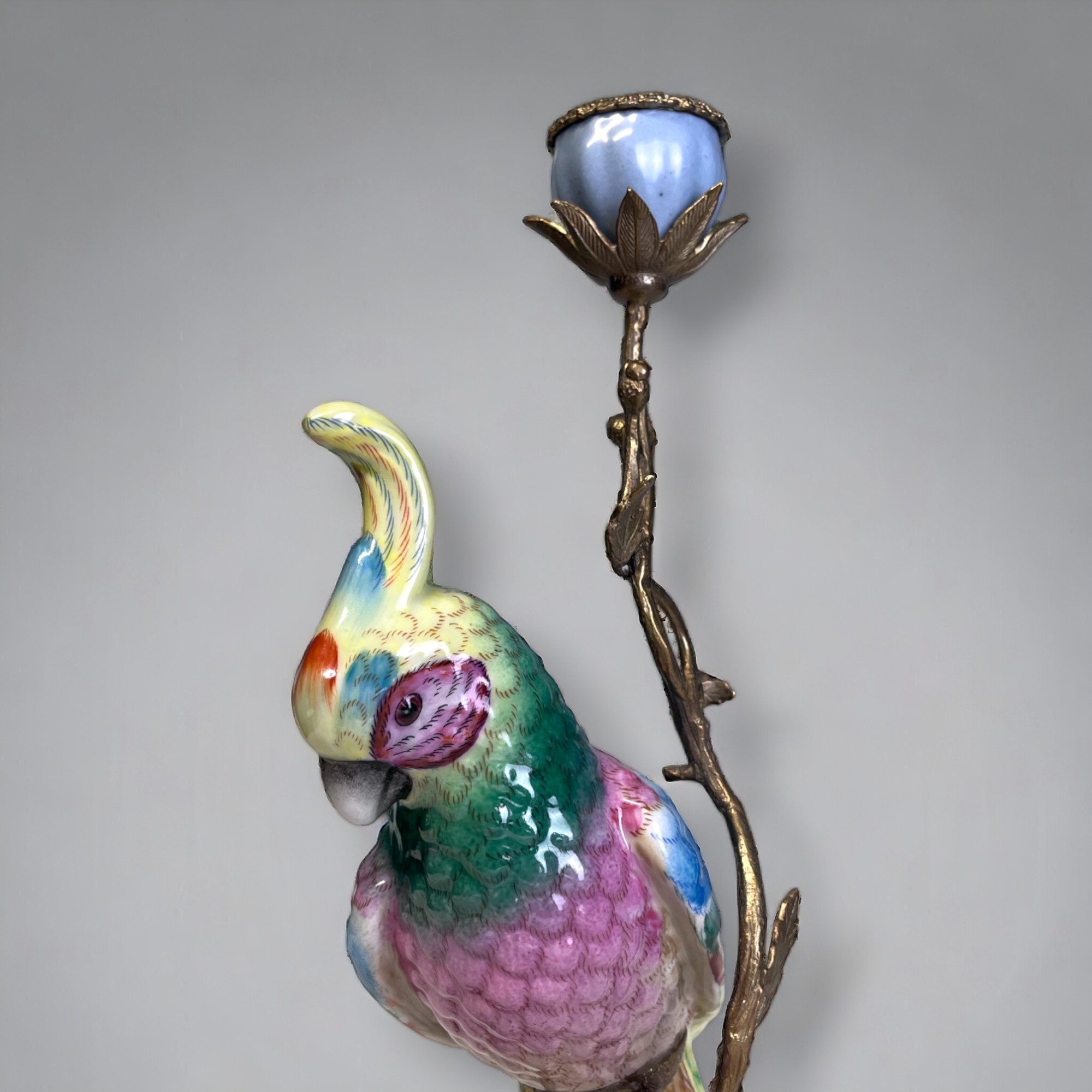A PAIR OF LARGE HANDPAINTED CERAMIC PARROTS CANDLESTICKS. Gilt metal ...