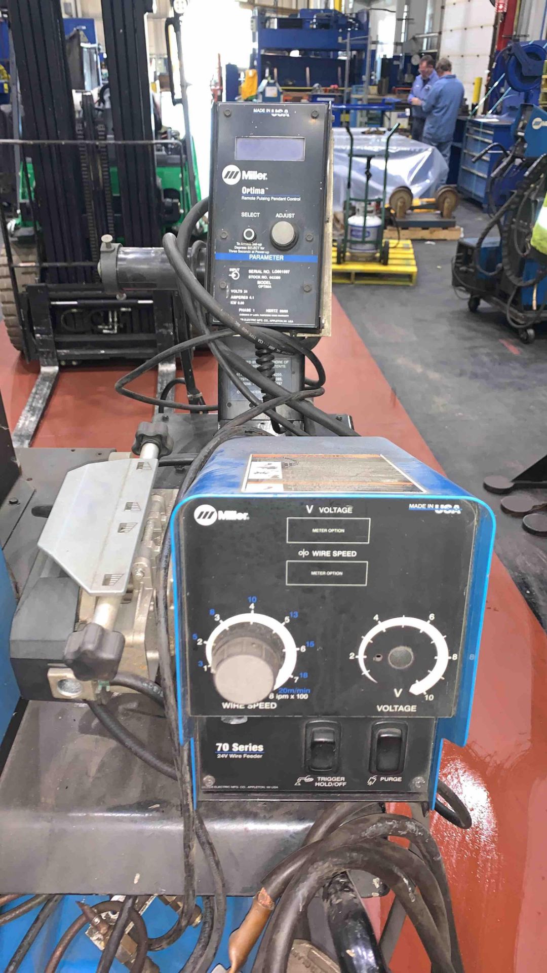 DUAL MILLER WELDING STATION WITH (2) XMT 304 WELDERS, (2) WIRE FEEDERS ...