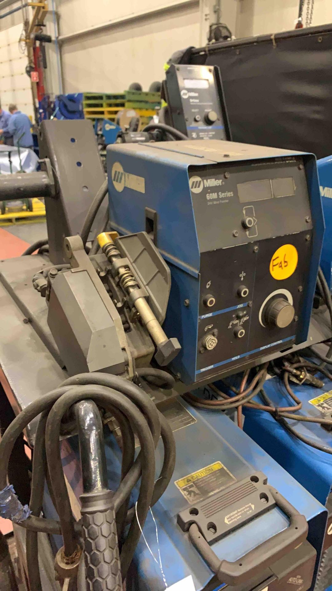 DUAL MILLER WELDING STATION WITH (2) XMT 304 WELDERS, (2) WIRE FEEDERS ...