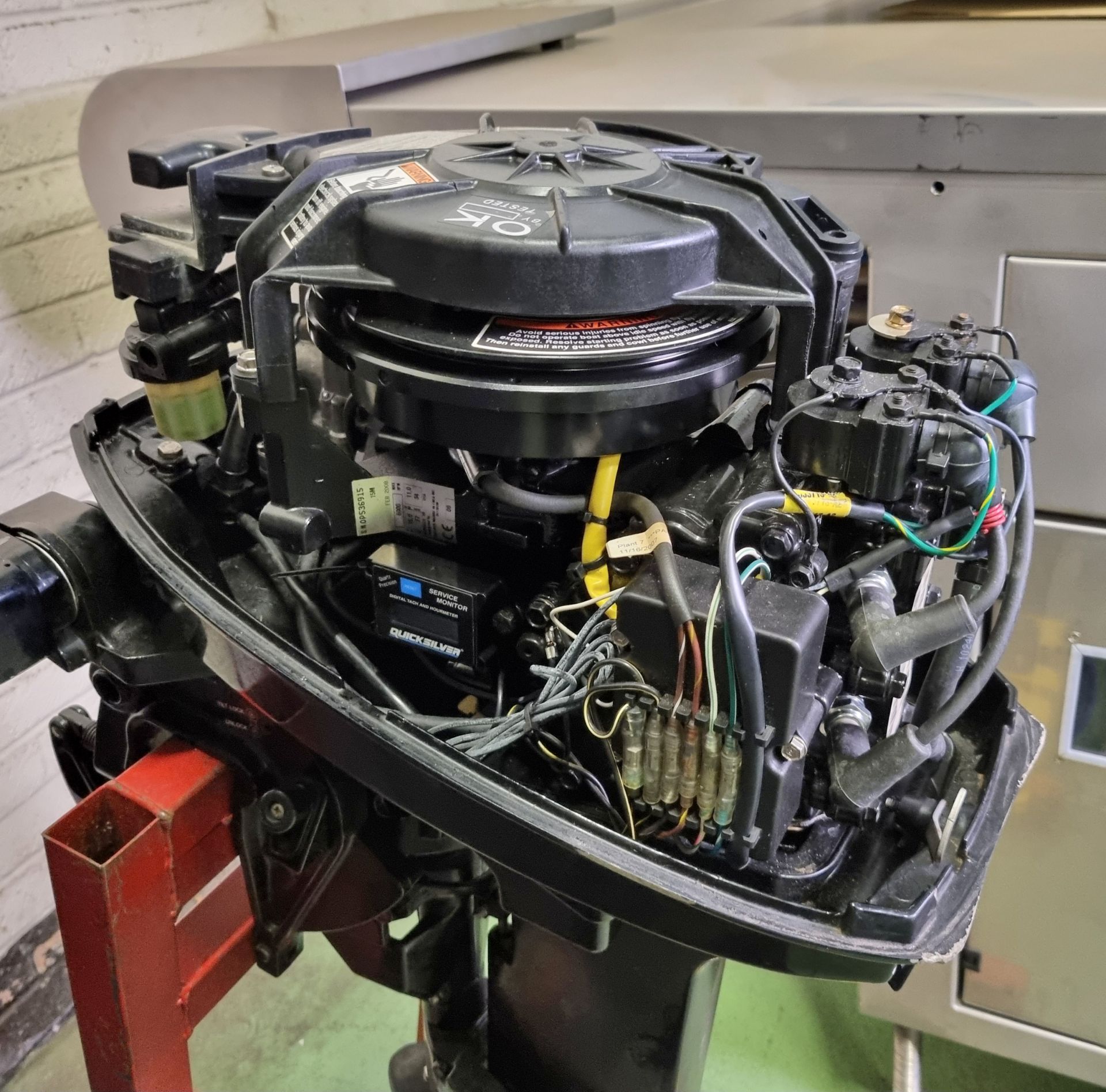 Mariner 15 HP outboard motor on stand - Serial No: OP536915