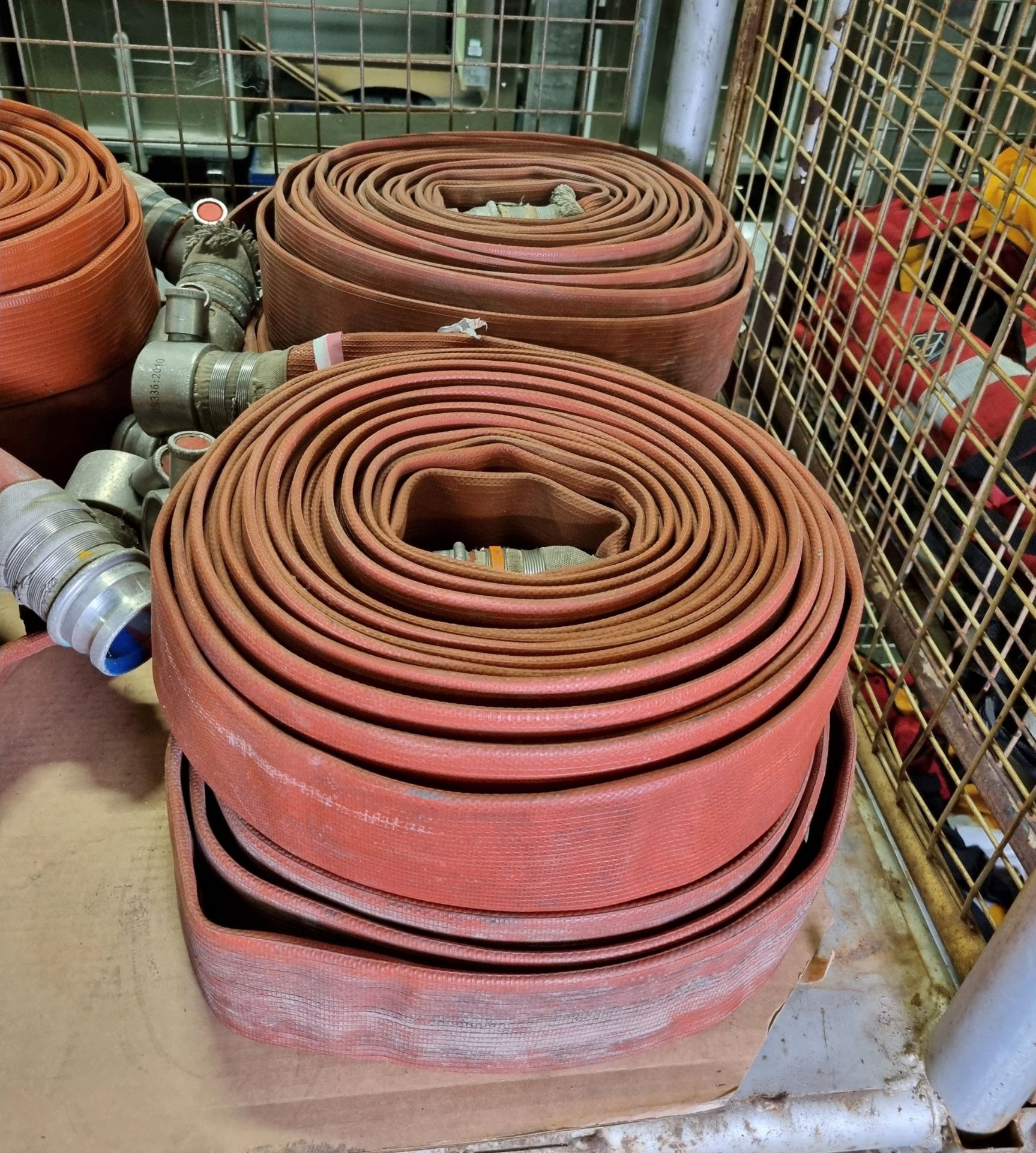 8x Red 70mm lay flat hoses with couplings - approx 23m in length