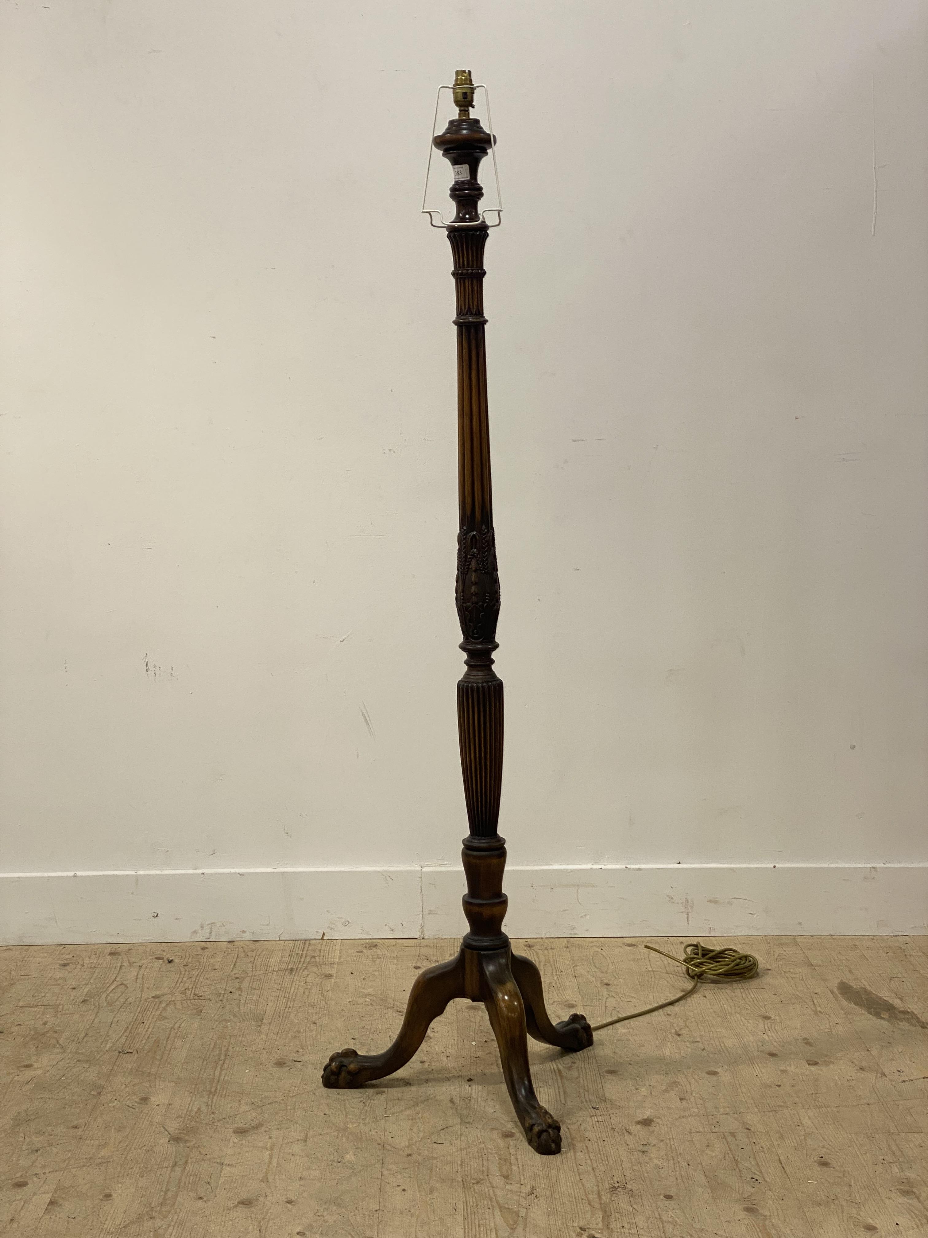 A 1920's mahogany standard lamp in the Georgian style, standing on ...