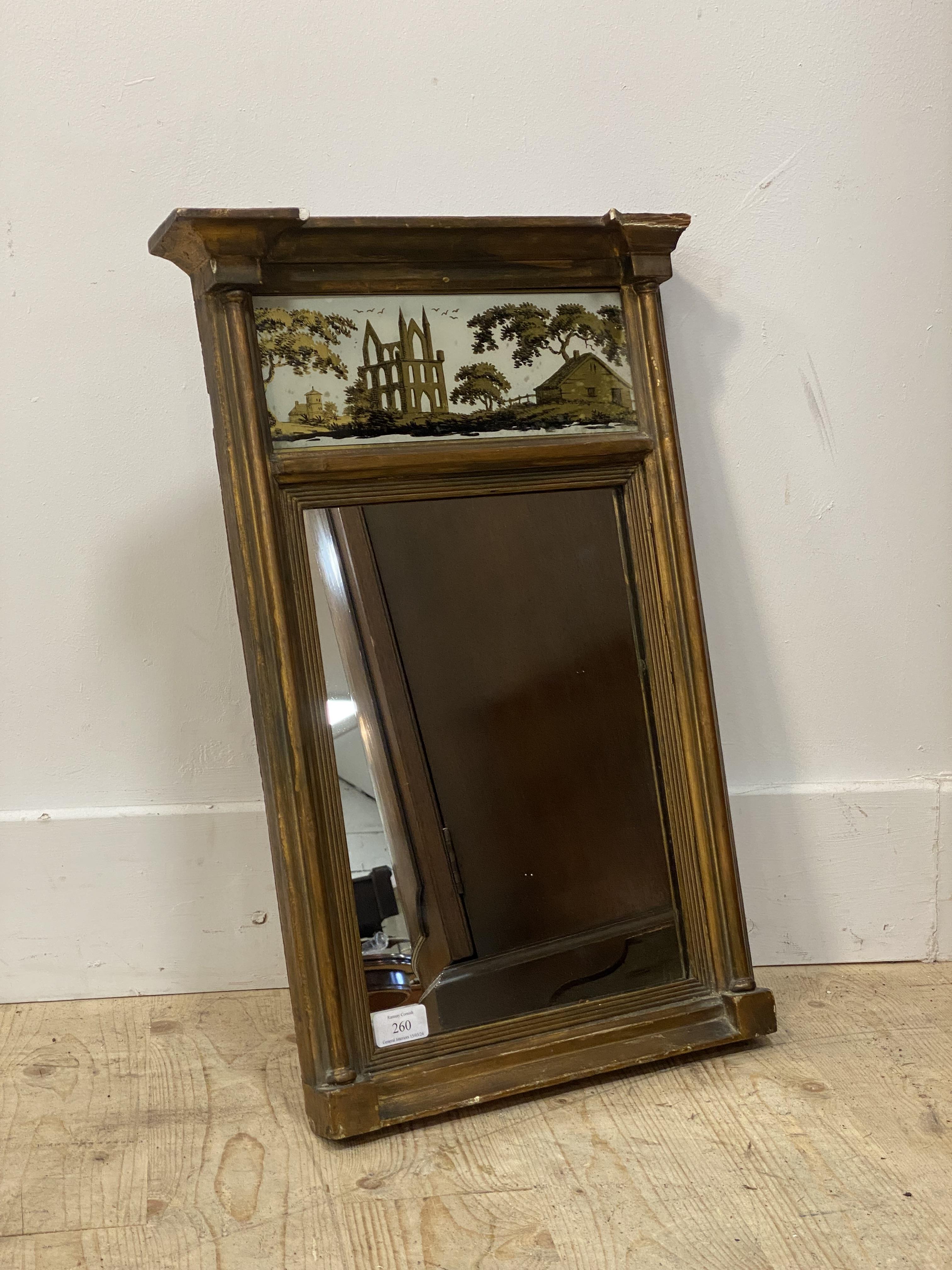 A Regency gilt framed pier glass mirror, inset with verre eglomise ...