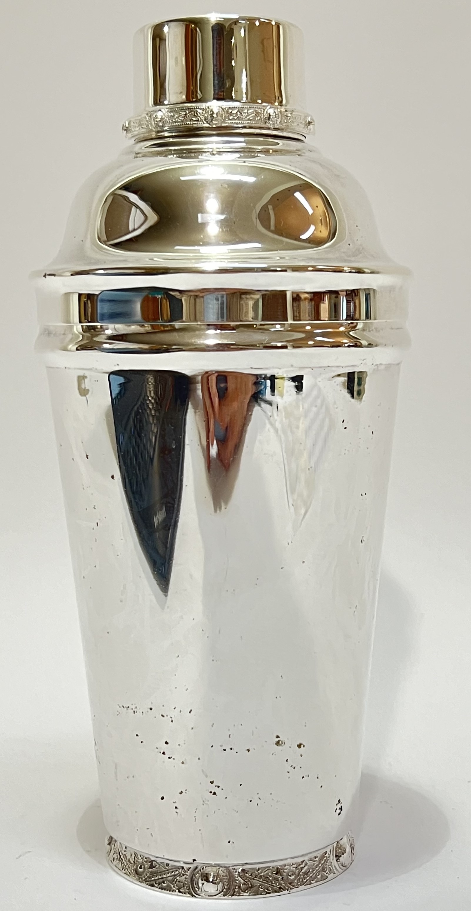 A silver plated cocktail shaker with Celtic/Anglo-saxon interlace ...