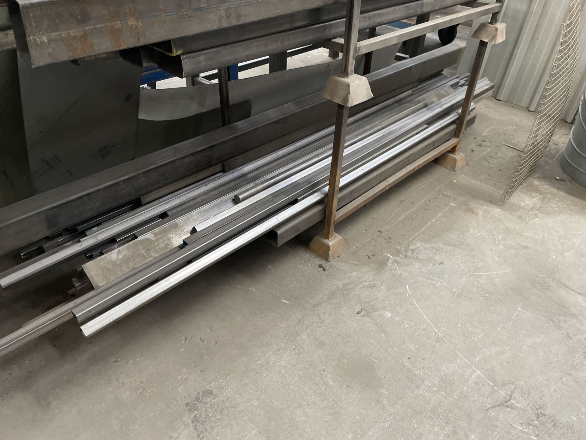 Three Steel Post Stillages, with assorted steel plates, angle, tube ...