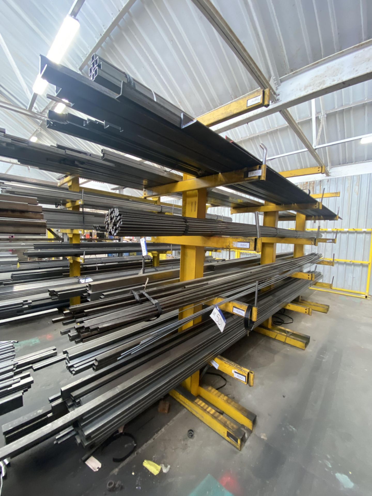 Steel Bar & Box Section Stock, on four tiers of one side of stock rack ...