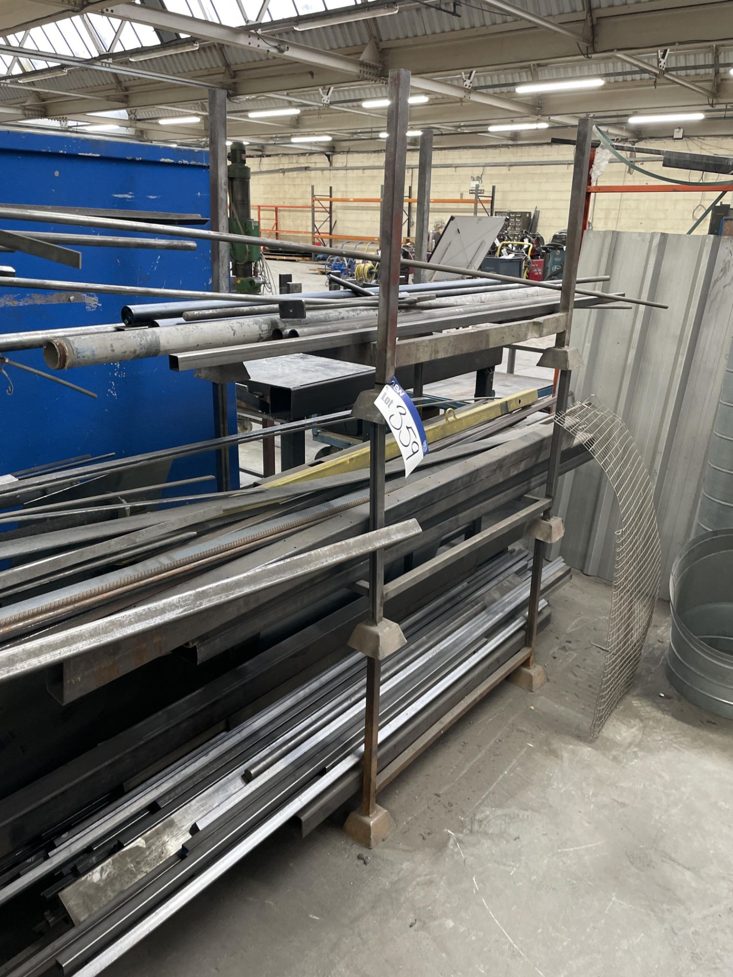 Three Steel Post Stillages, with assorted steel plates, angle, tube ...