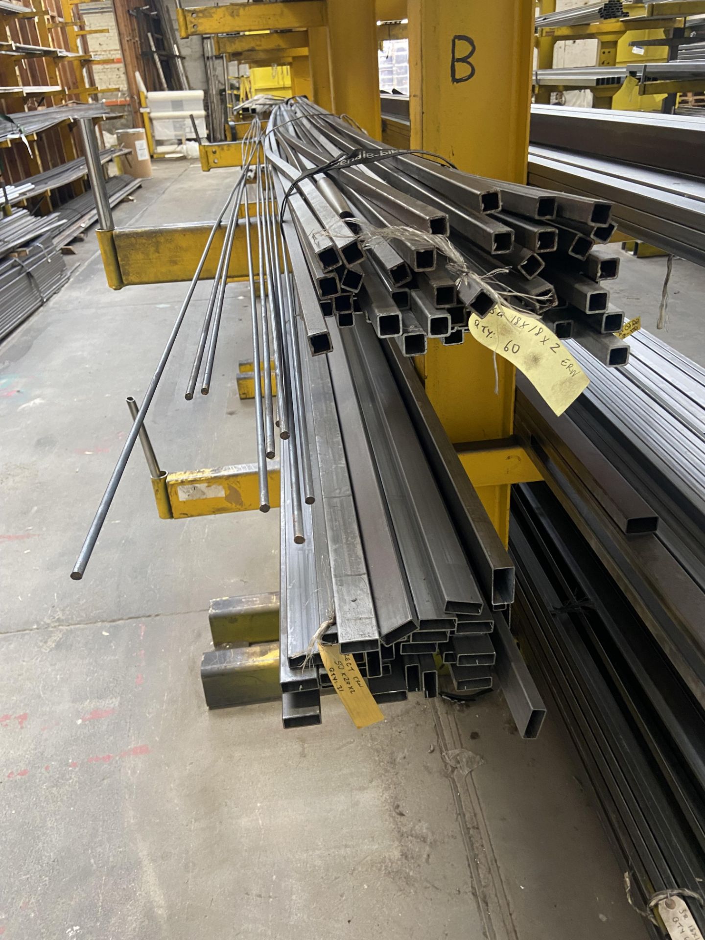 Steel Bar & Box Section Stock, on four tiers of one side of stock rack ...