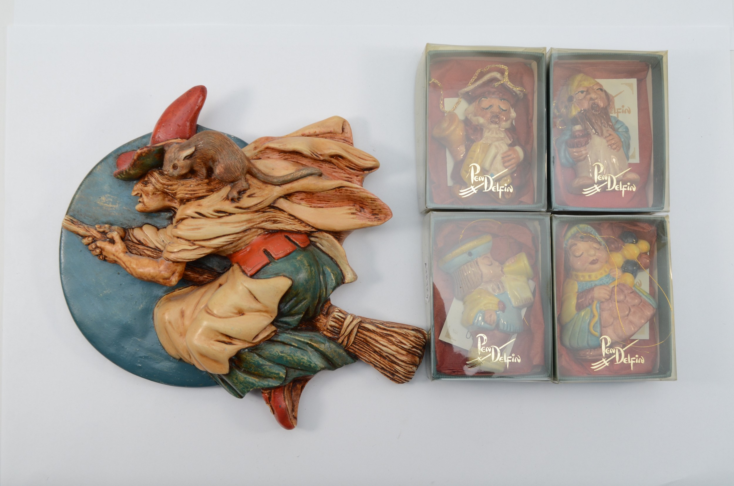 Pendelfin; a witches plaque, 22cm diameter together with four boxed ...