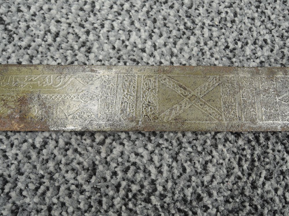 A Sudanese Kaskara Sword having highly decorated blade with Arabic ...