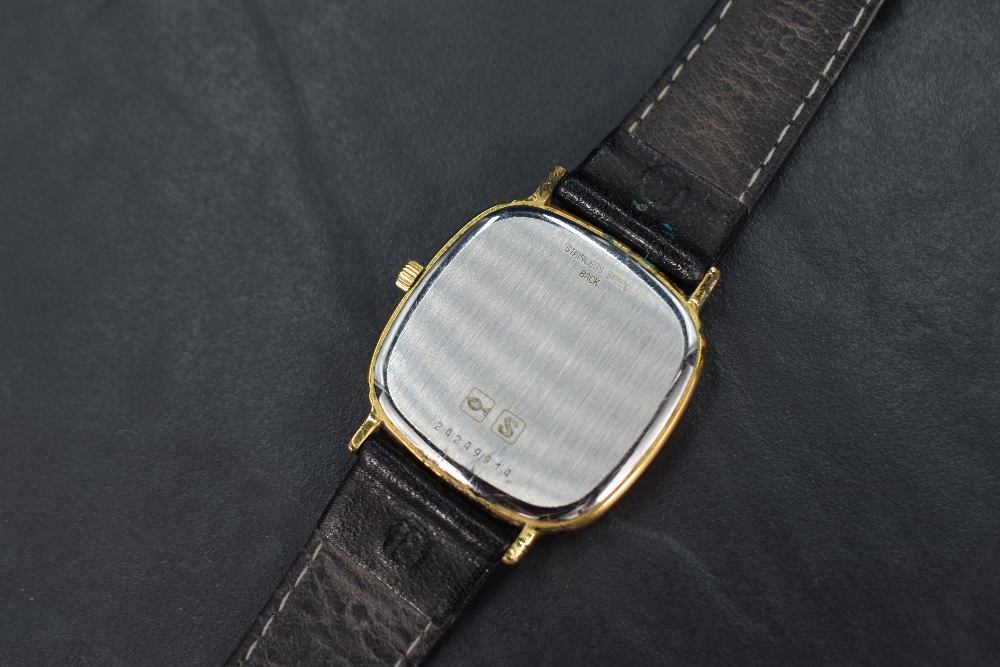 A gent's Longines wristwatch, the rounded square face having a white ...