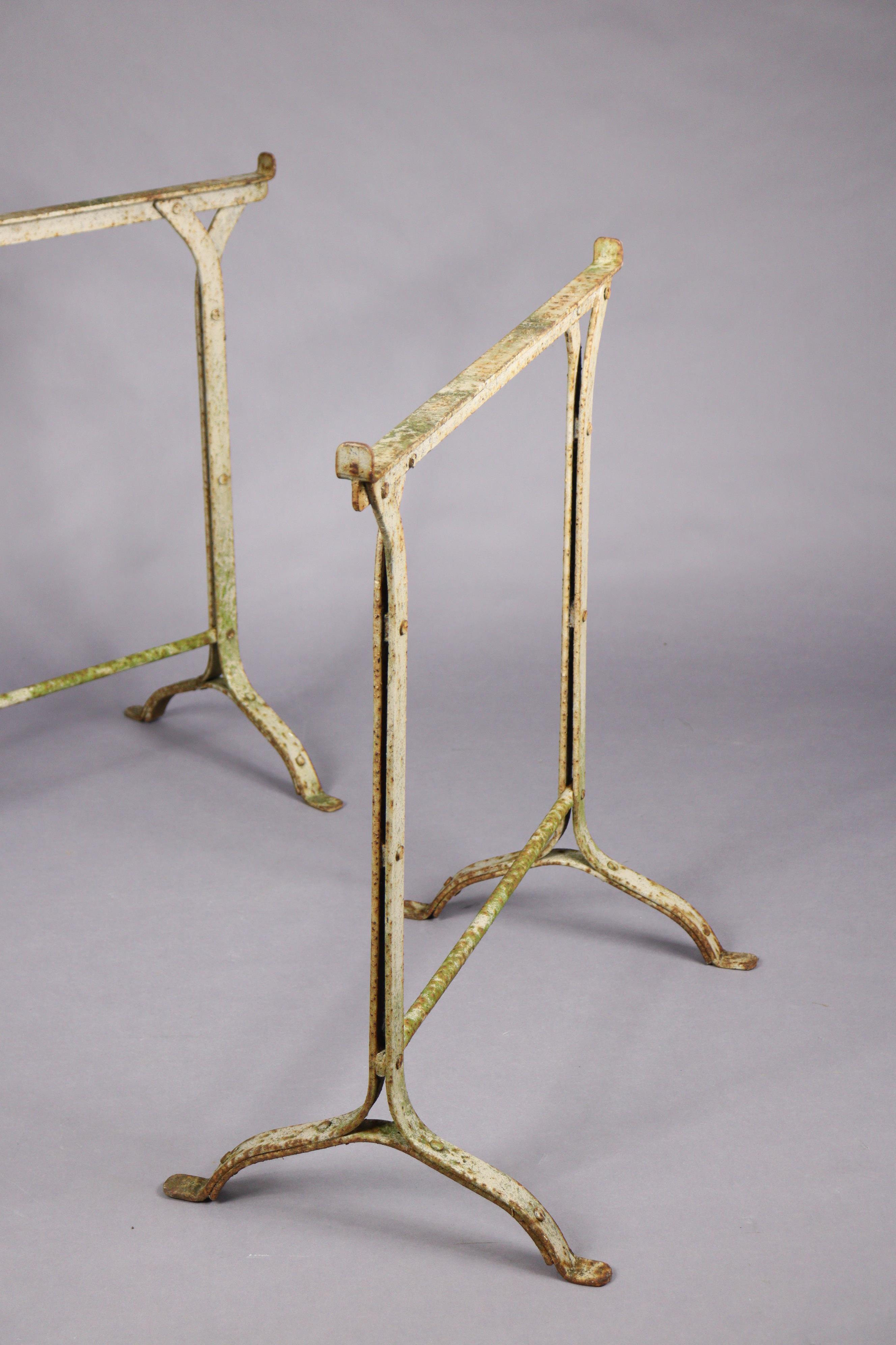 A pair of vintage white painted cast-iron trestle table supports, 74 ...