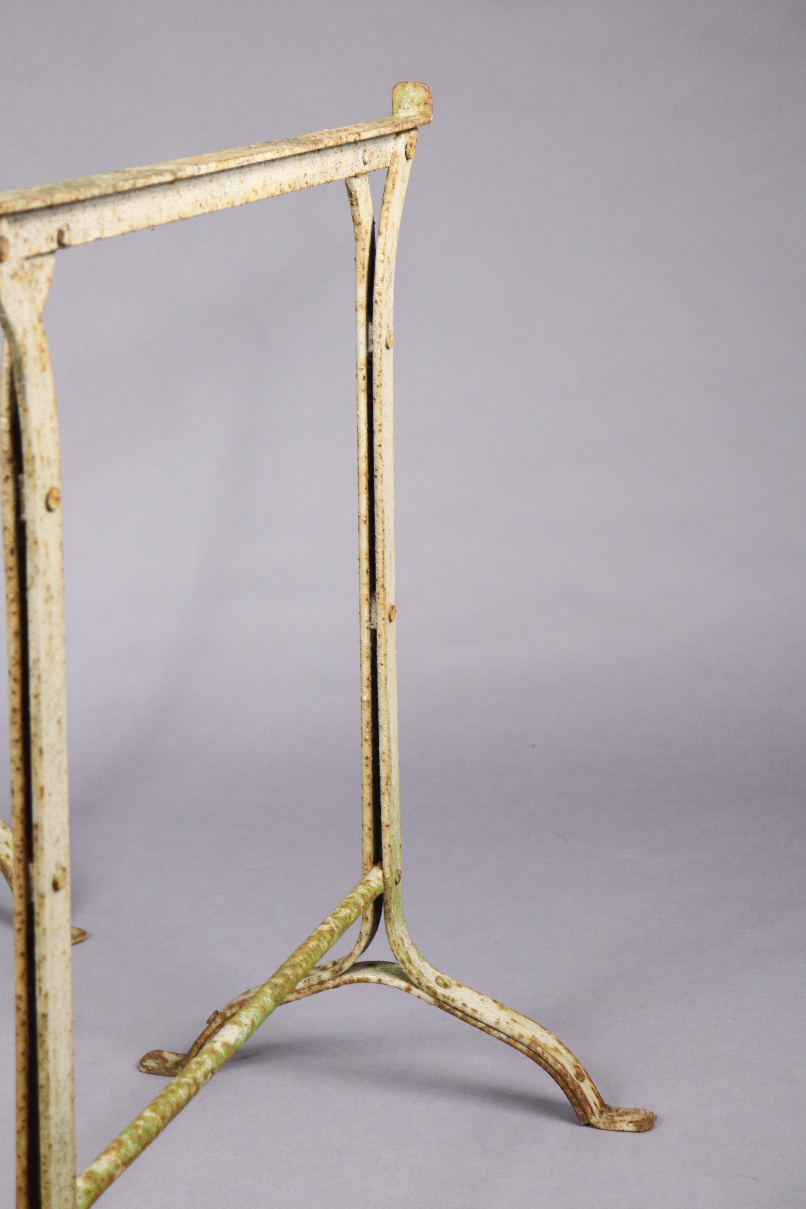 A pair of vintage white painted cast-iron trestle table supports, 74 ...