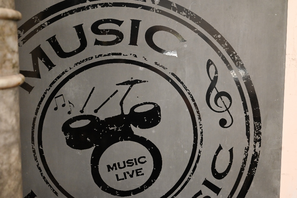 Metal over wood modern music advertising sign, 68 x 68 cm