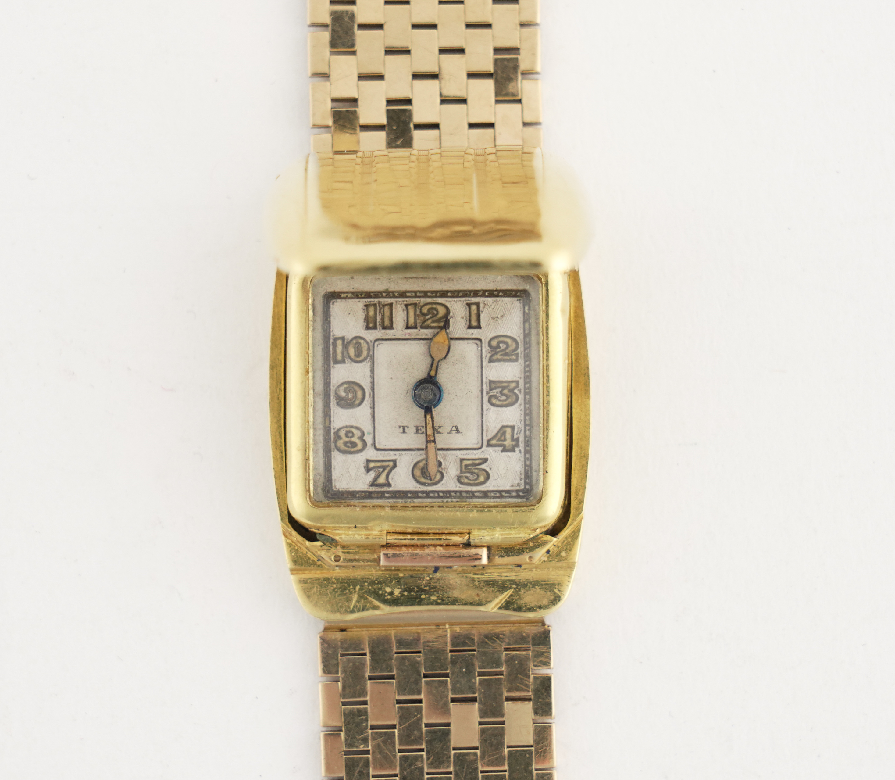 TEXA: AN 18CT GOLD CASED MANUAL WIND HIDDEN WRISTWATCHCirca 1960s, the ...