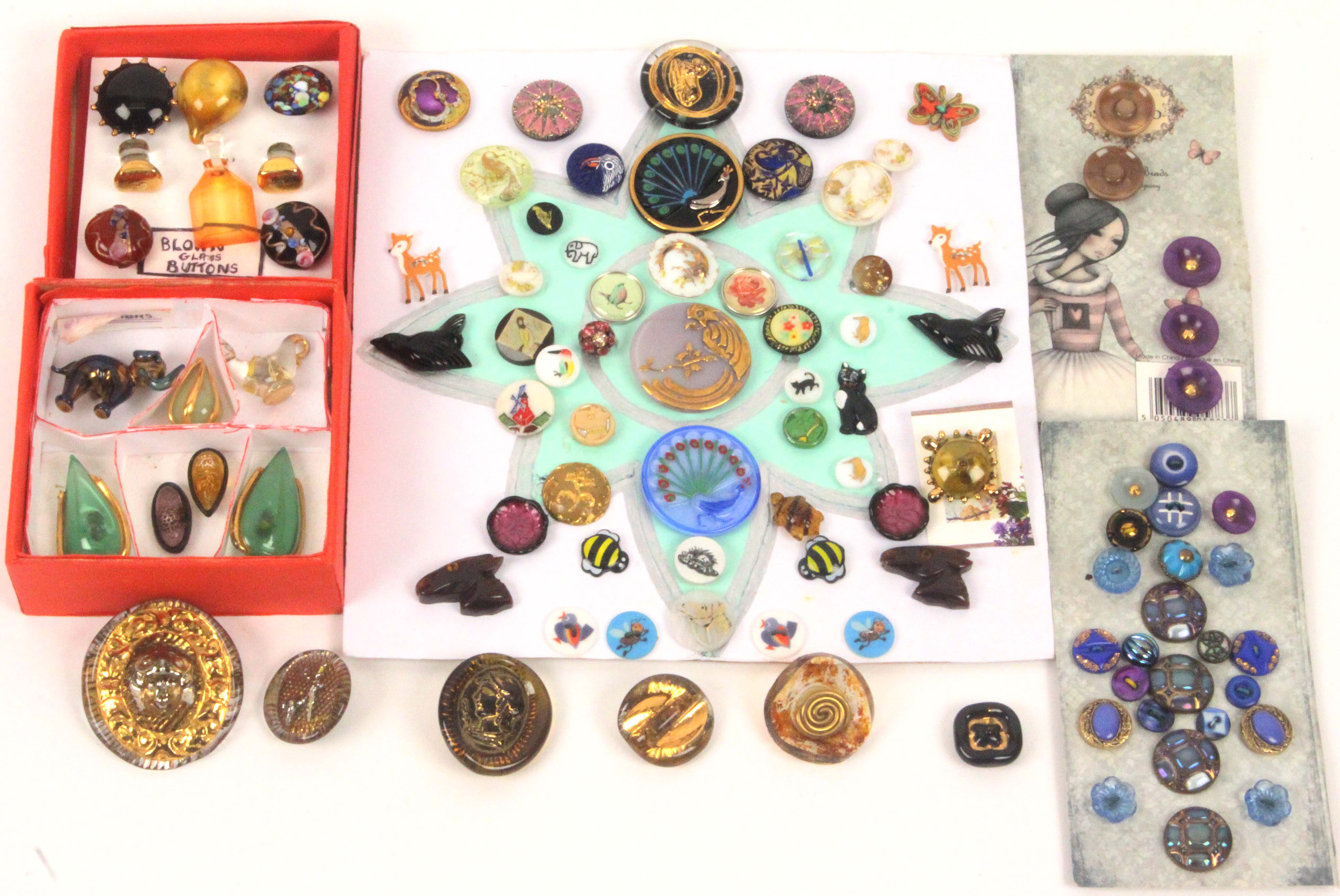 Buttons, mostly 20th Century glass, comprising two boxed displays of ...
