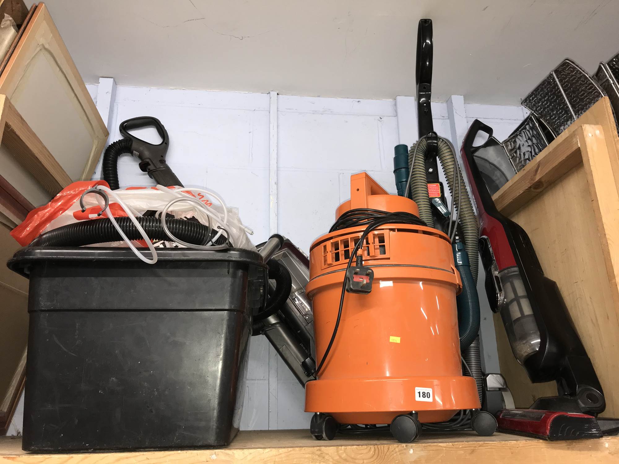 Shelf of various hoover parts etc