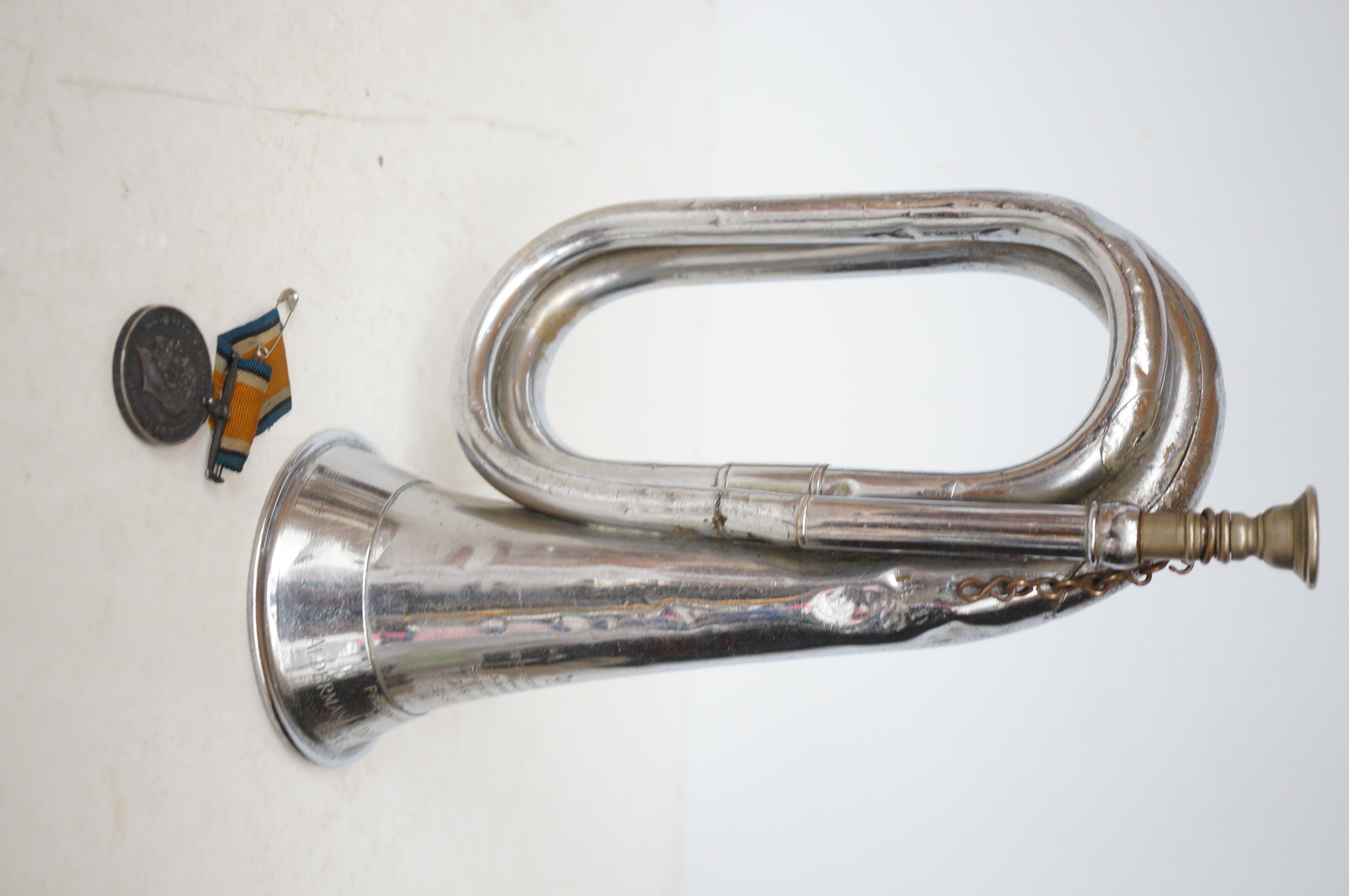 Possibly military bugle together with 1914-1918 medal