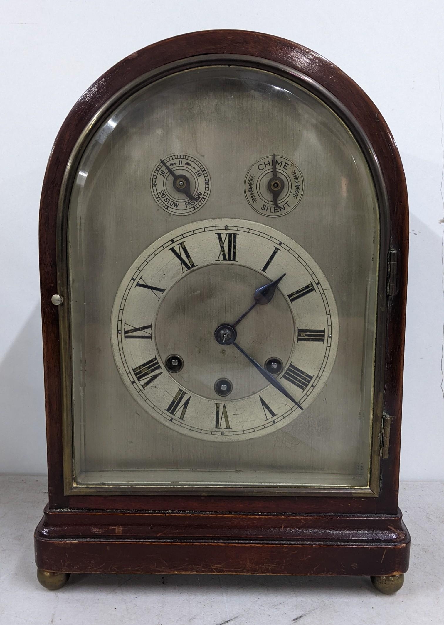 An Edwardian mahogany arched top 8 day mantle clock having subsidiary ...