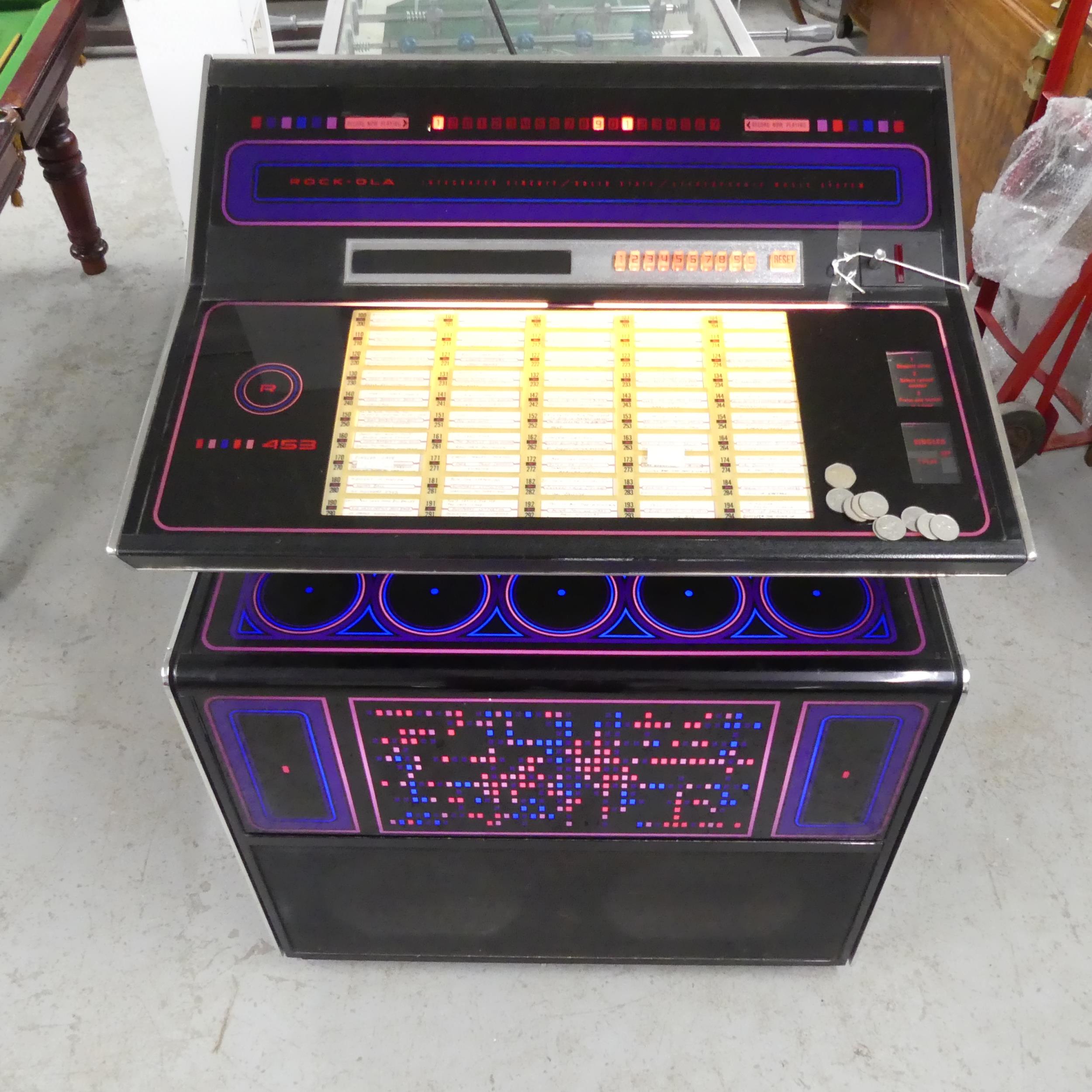 A Rock-Ola R453 Jukebox with vinyl records, circa 1970s. Working order ...